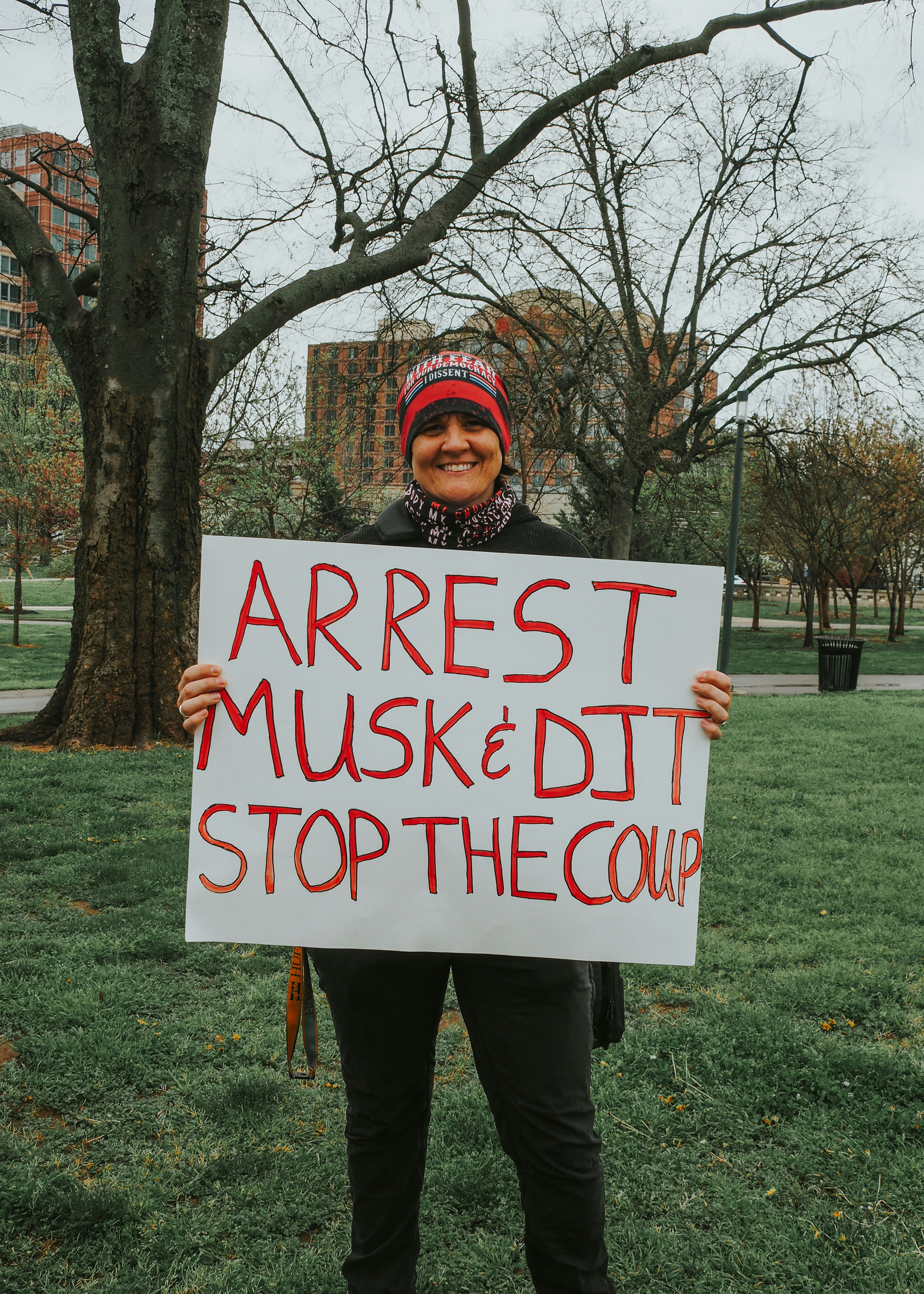 Protester demands arrest of musk and djt.