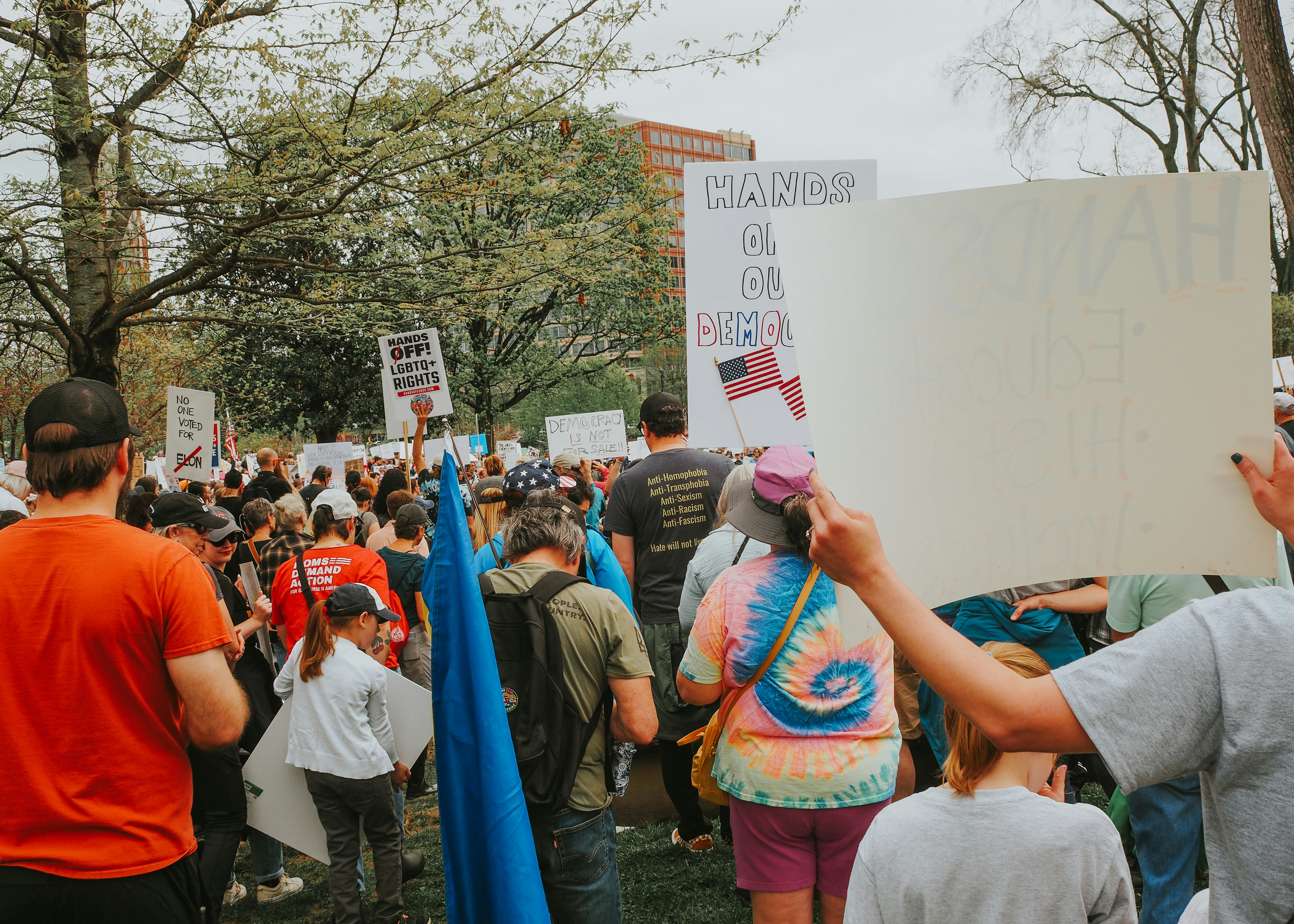 Protestors are marching with signs in a demonstration. photo – Free Car ...