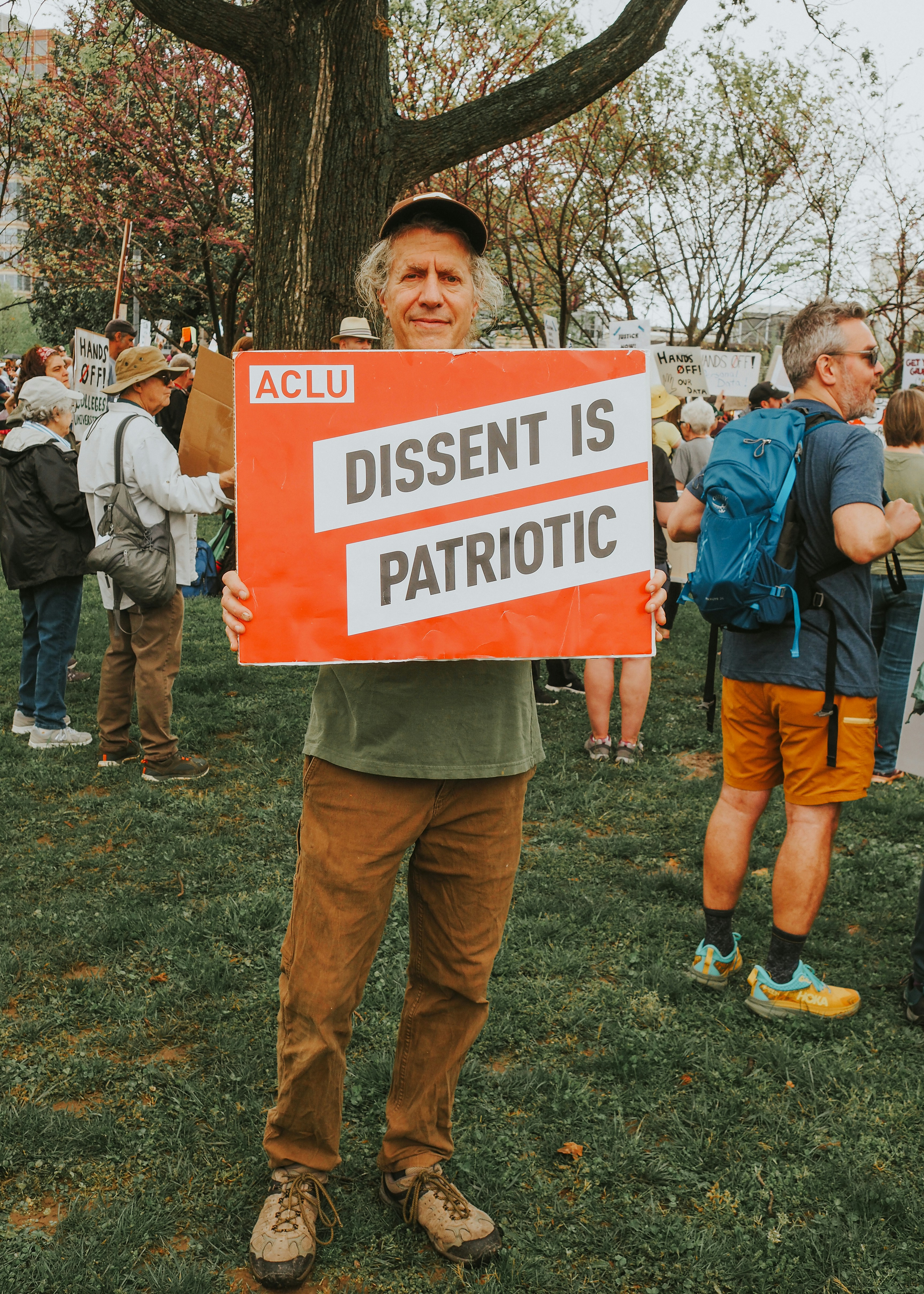 Man holds sign: "dissent is patriotic." photo – Free Forest Image on ...