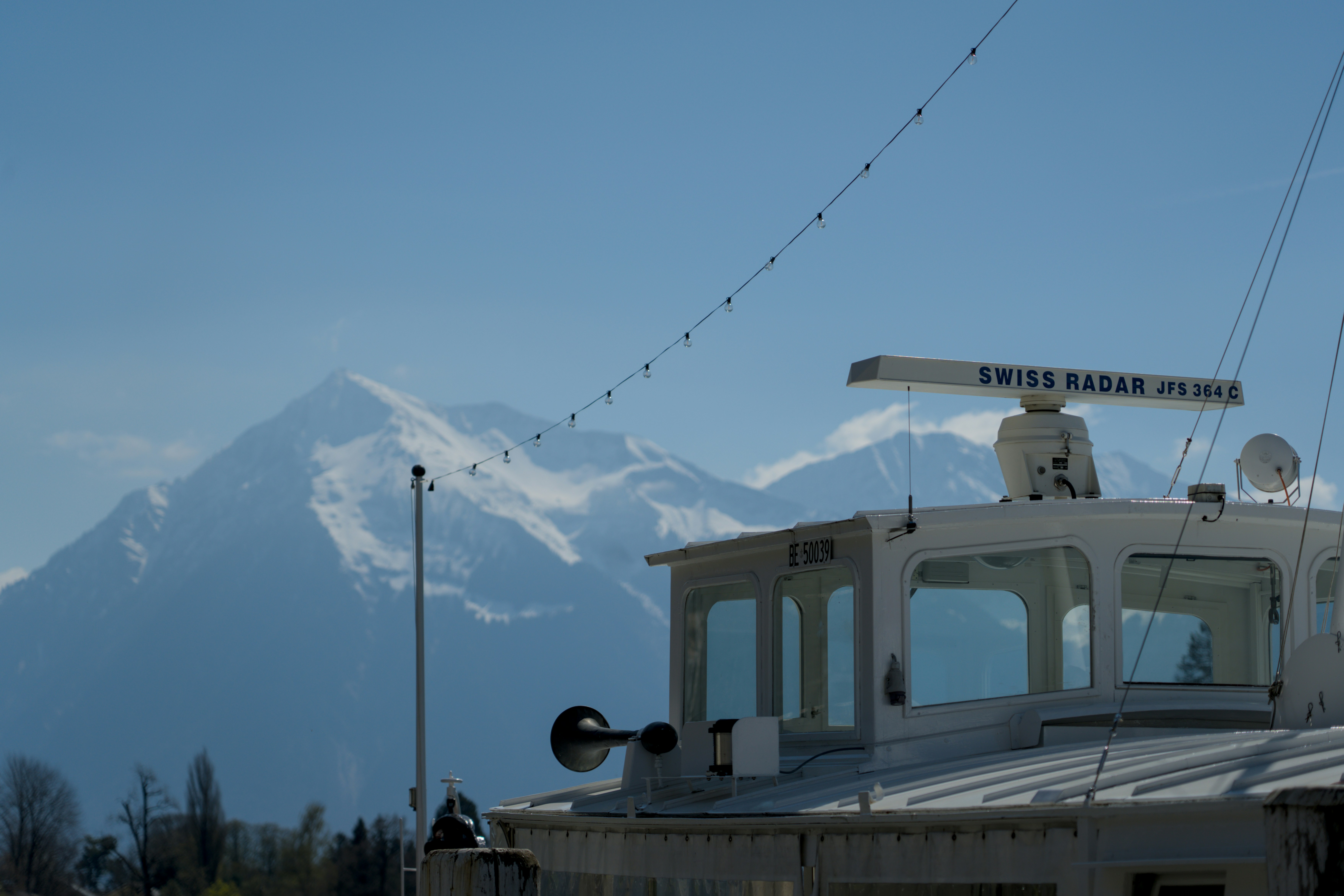 Majestic Peaks Overlooked by Quiet Vessel