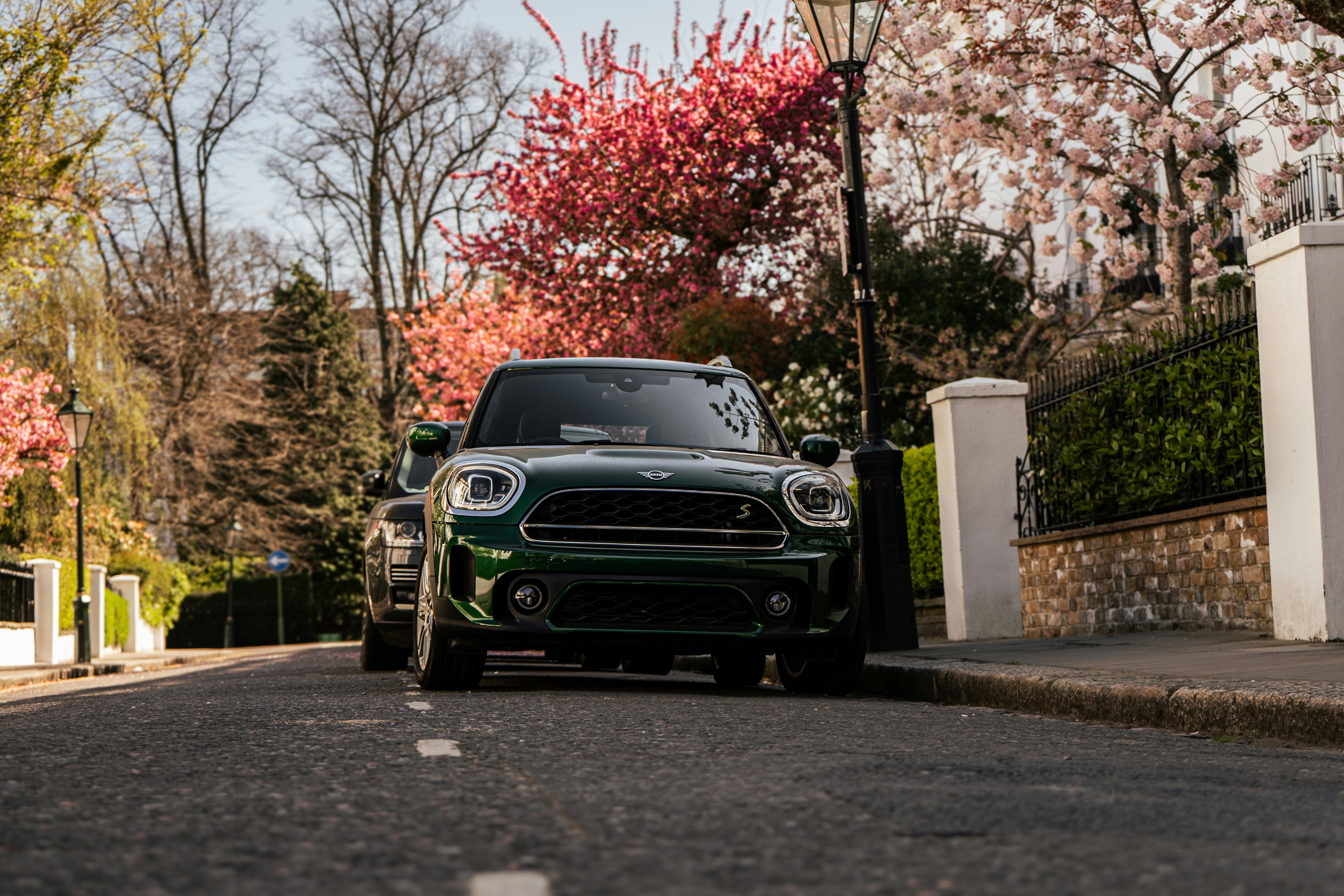 A green mini cooper parked on a beautiful street. photo – Free Car ...