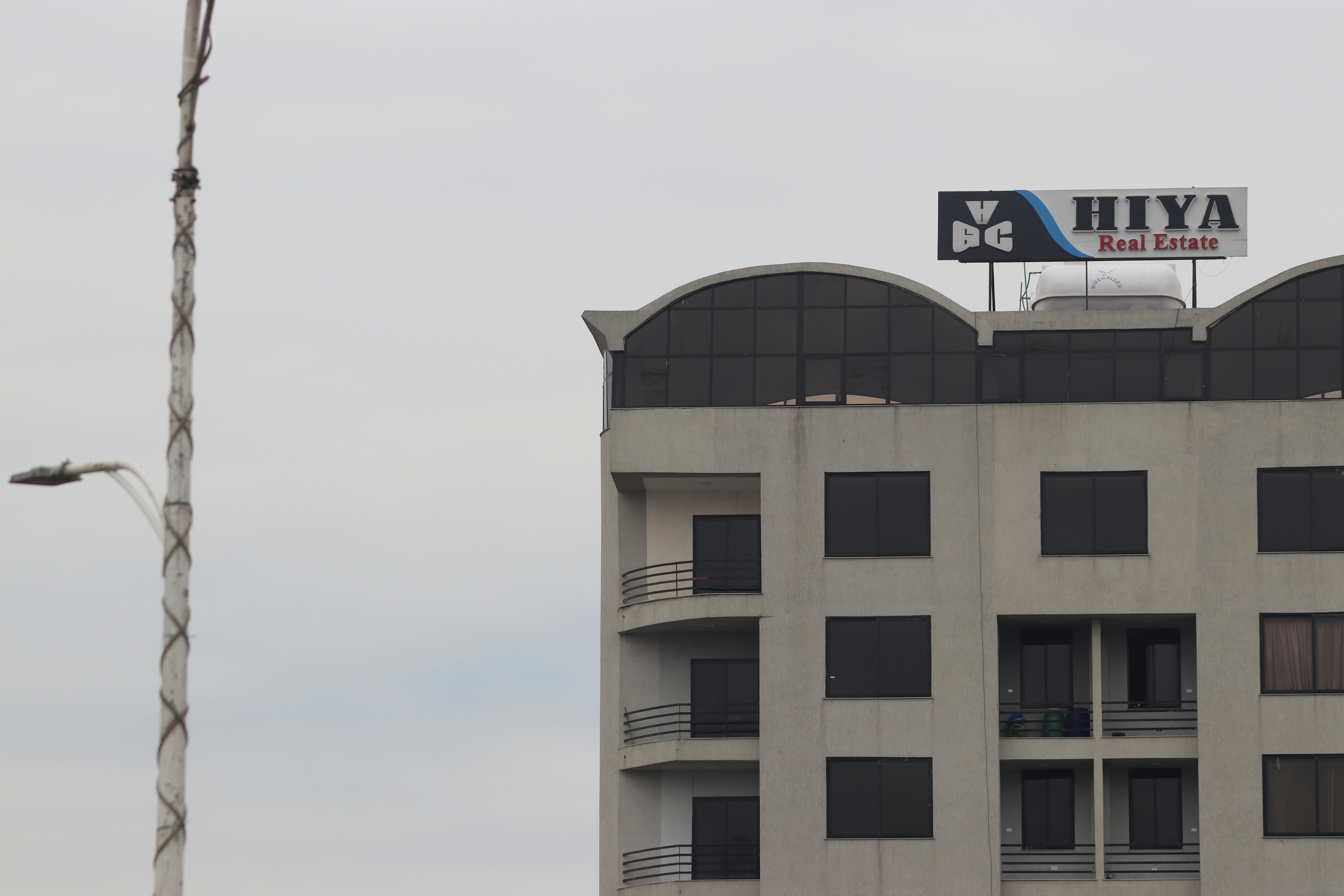 A building with a "hiya real estate" sign. photo – Free Building Image ...