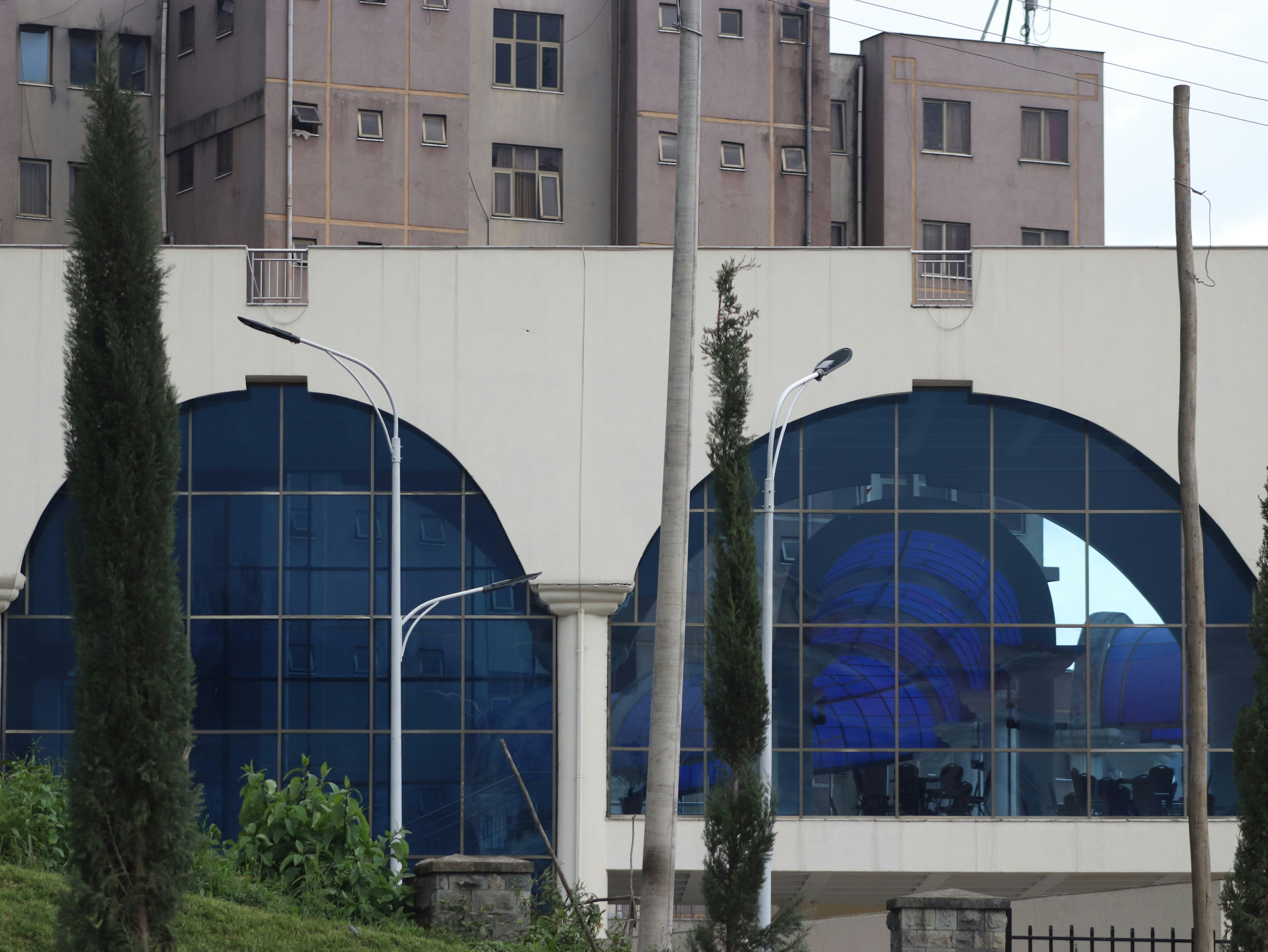 A modern building with arched blue windows. photo – Free City Image on ...