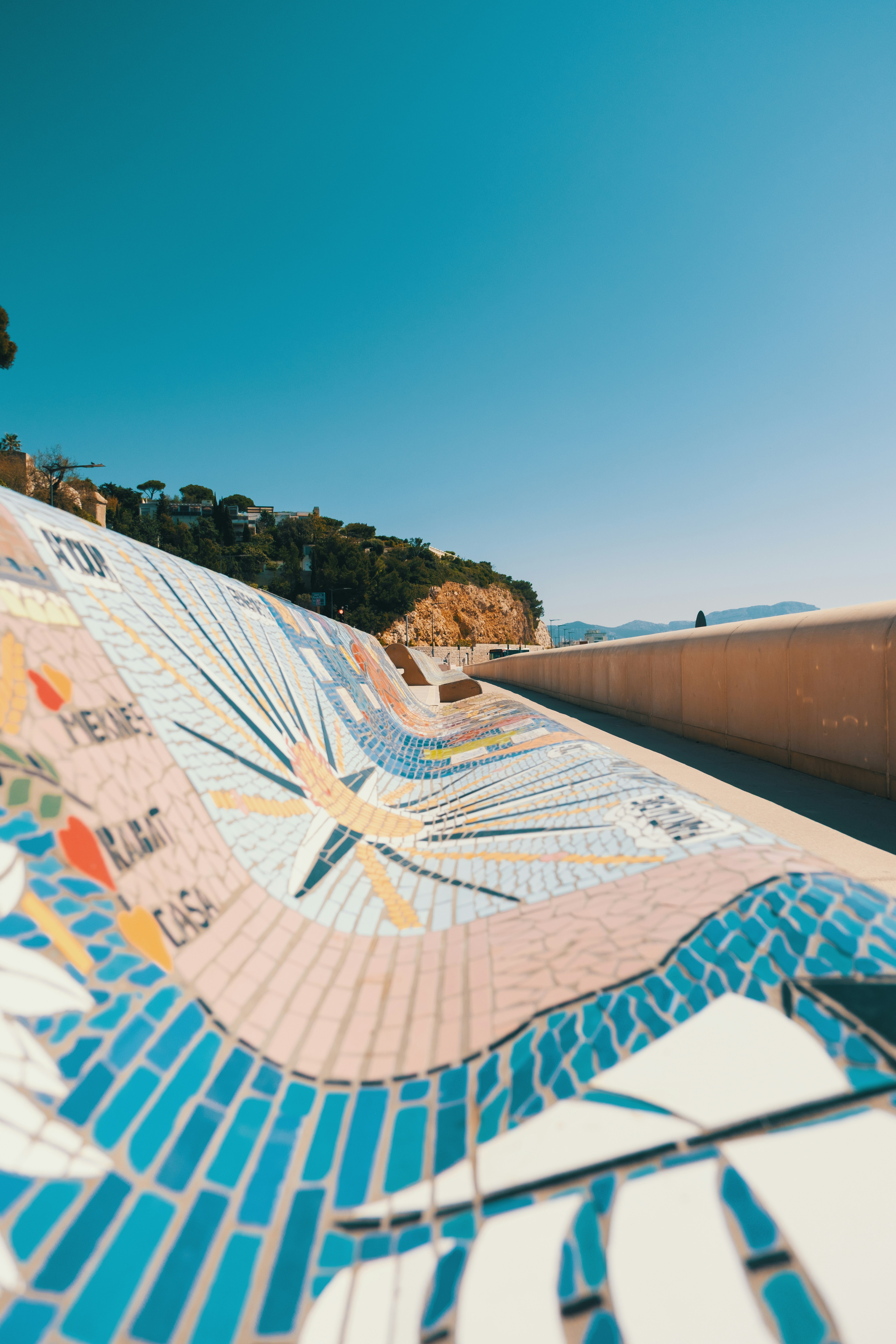 A colorful mosaic bench faces the sunny sky. photo – Free France Image ...