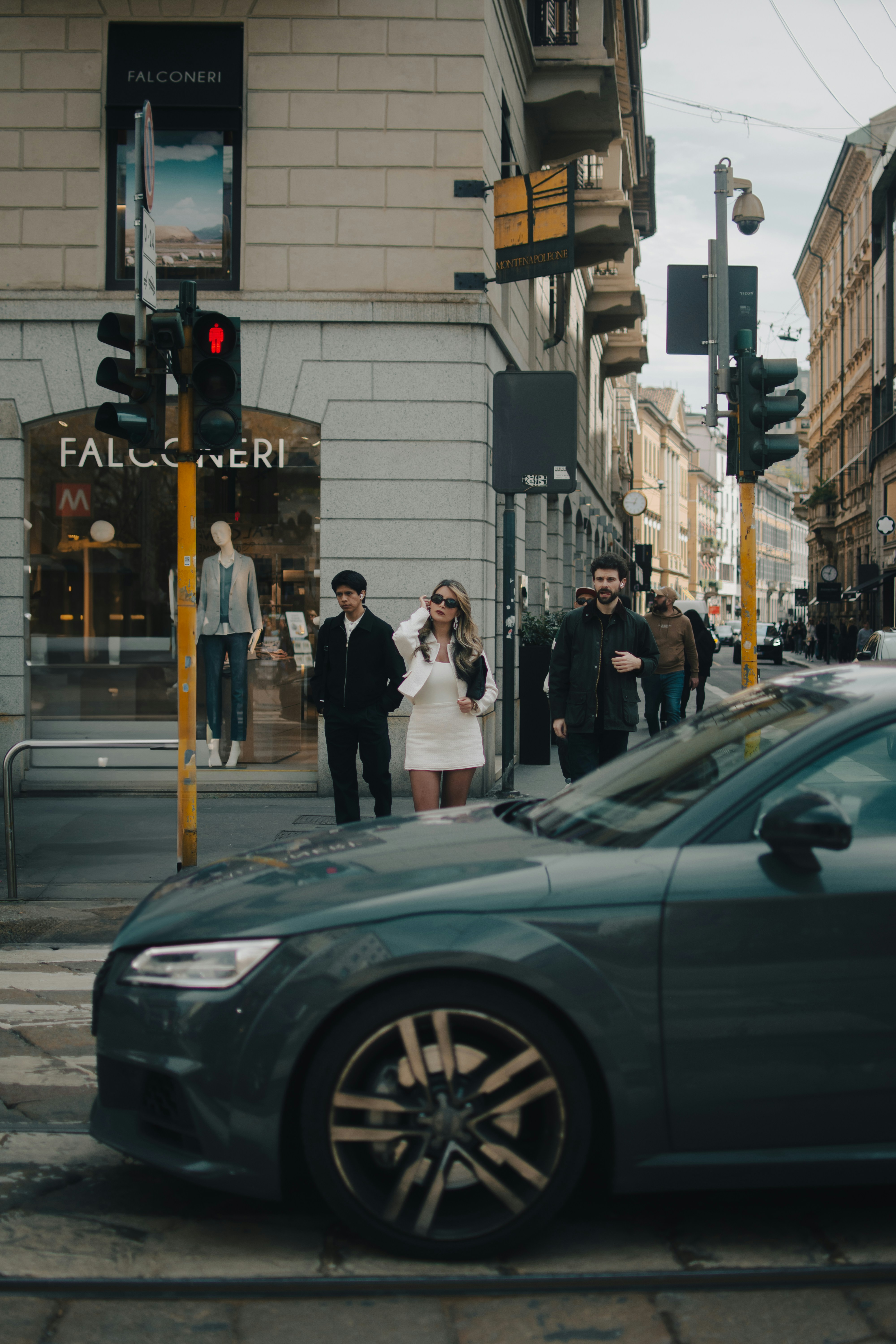 White-Dress Moment at a Falconeri Storefront Crosswalk