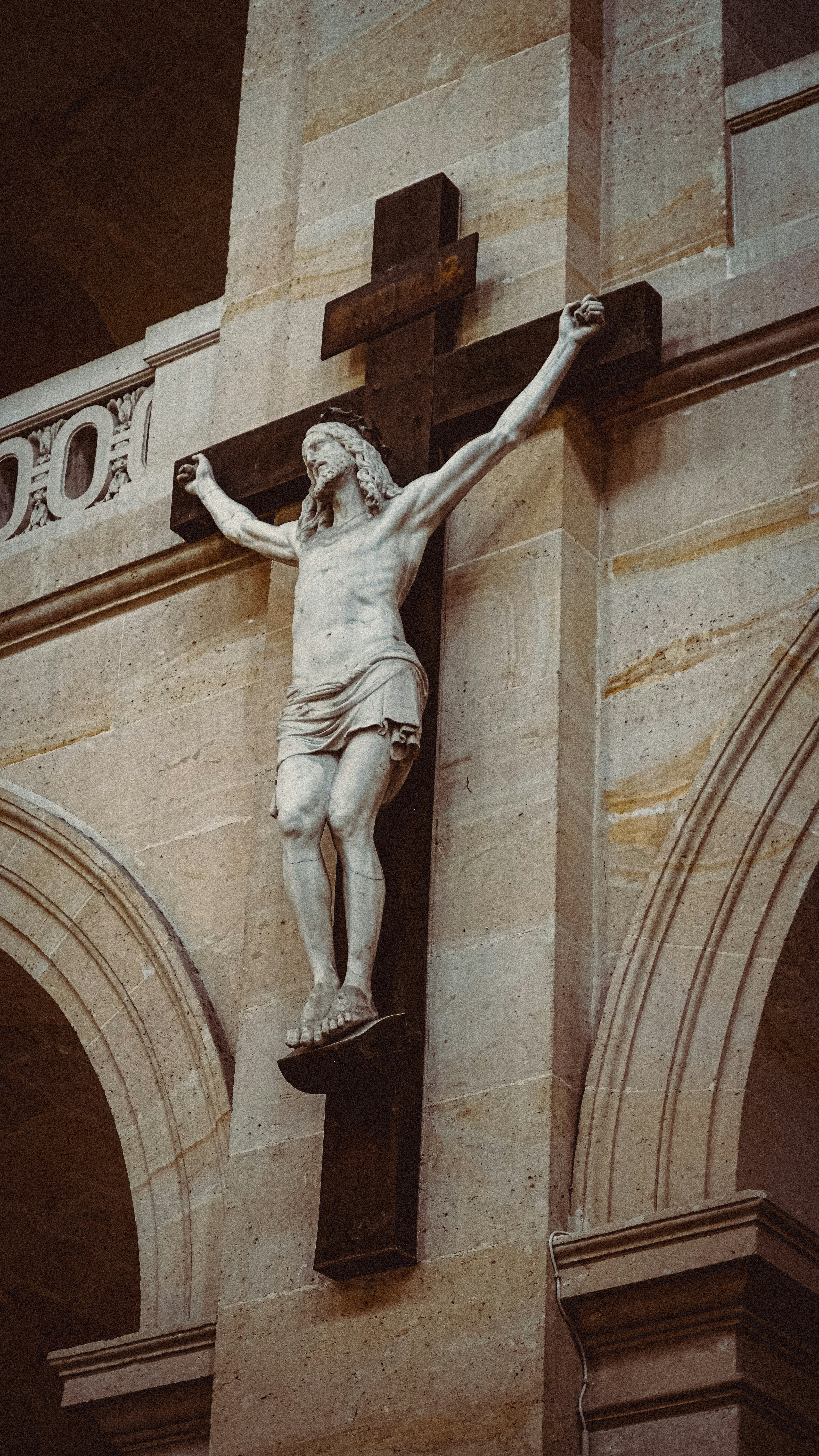 Jesus is crucified on a wooden cross.