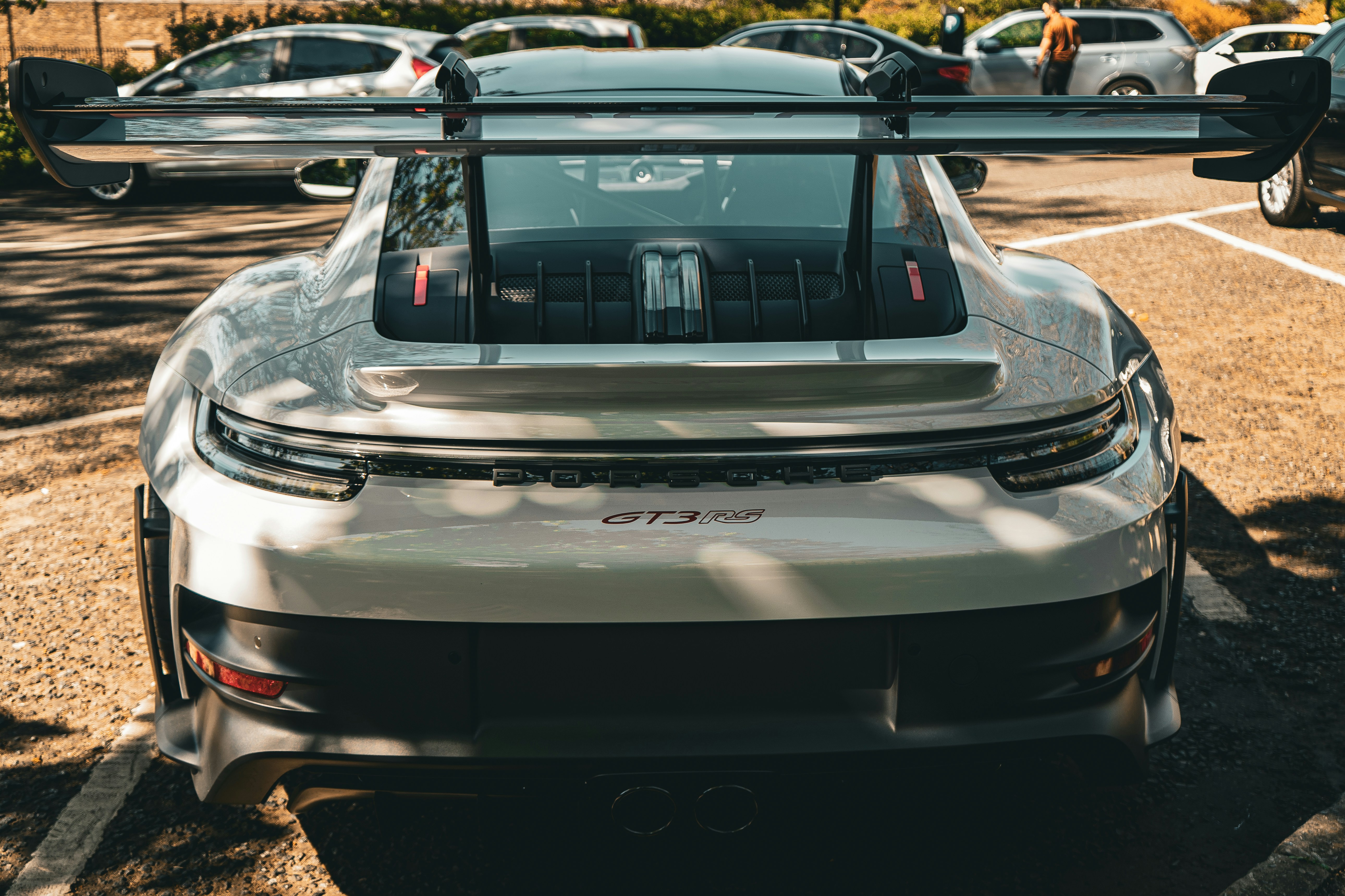 Here is a caption: a porsche gt3 with a large rear wing. photo – Free ...