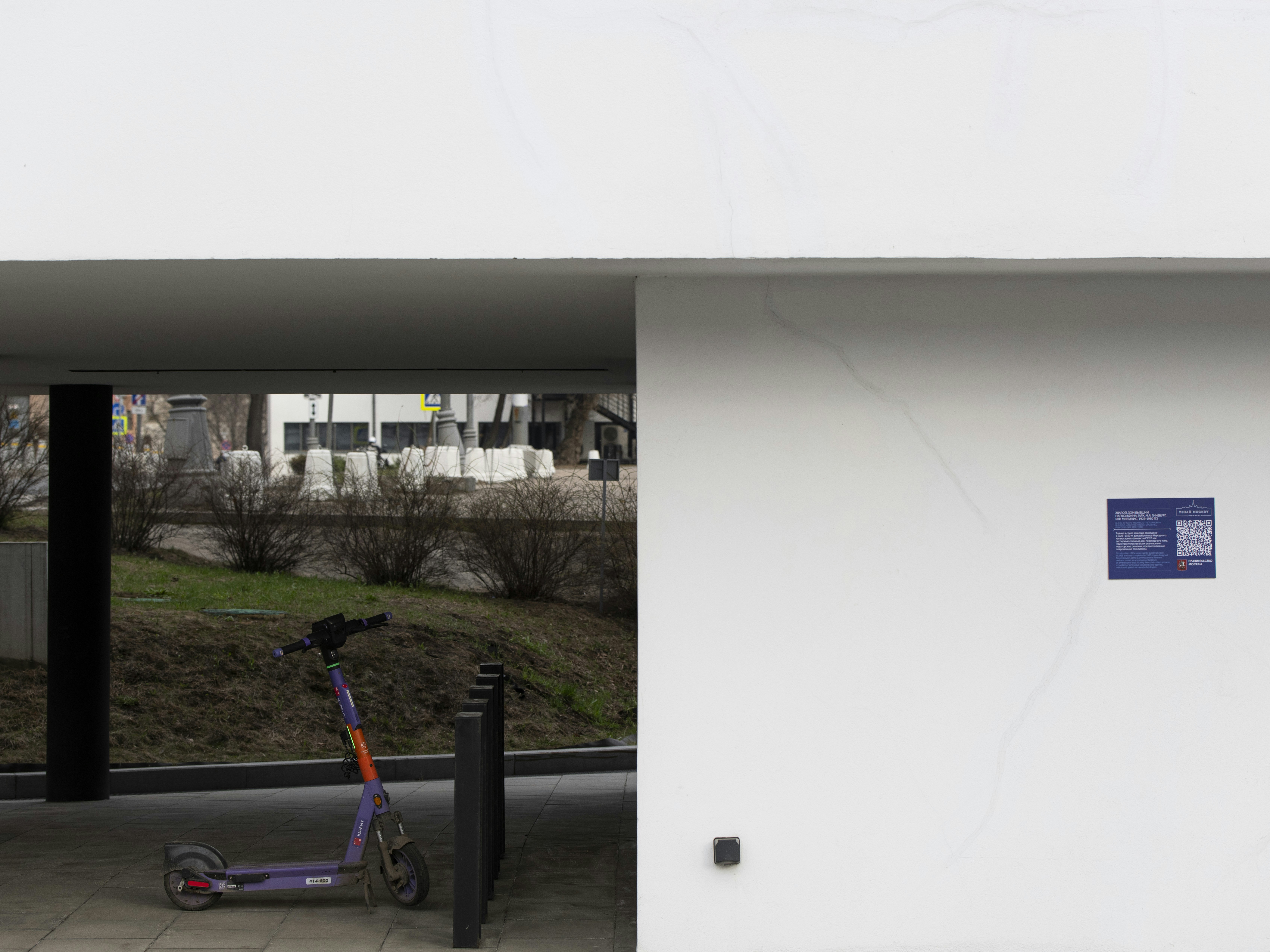 Urban Solitude: Scooter in Minimalist Space