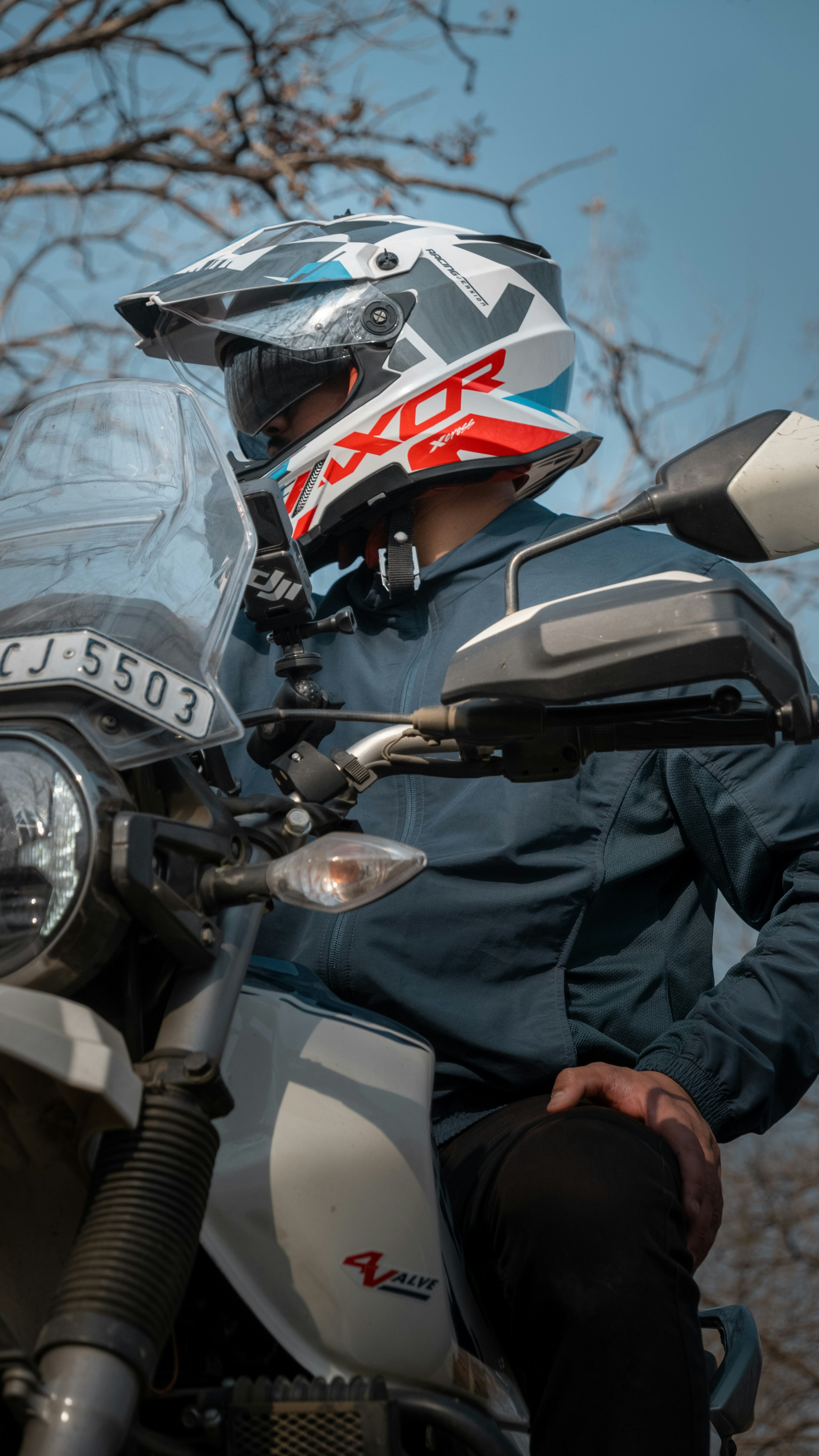 Rider's Pause Under Clear Skies