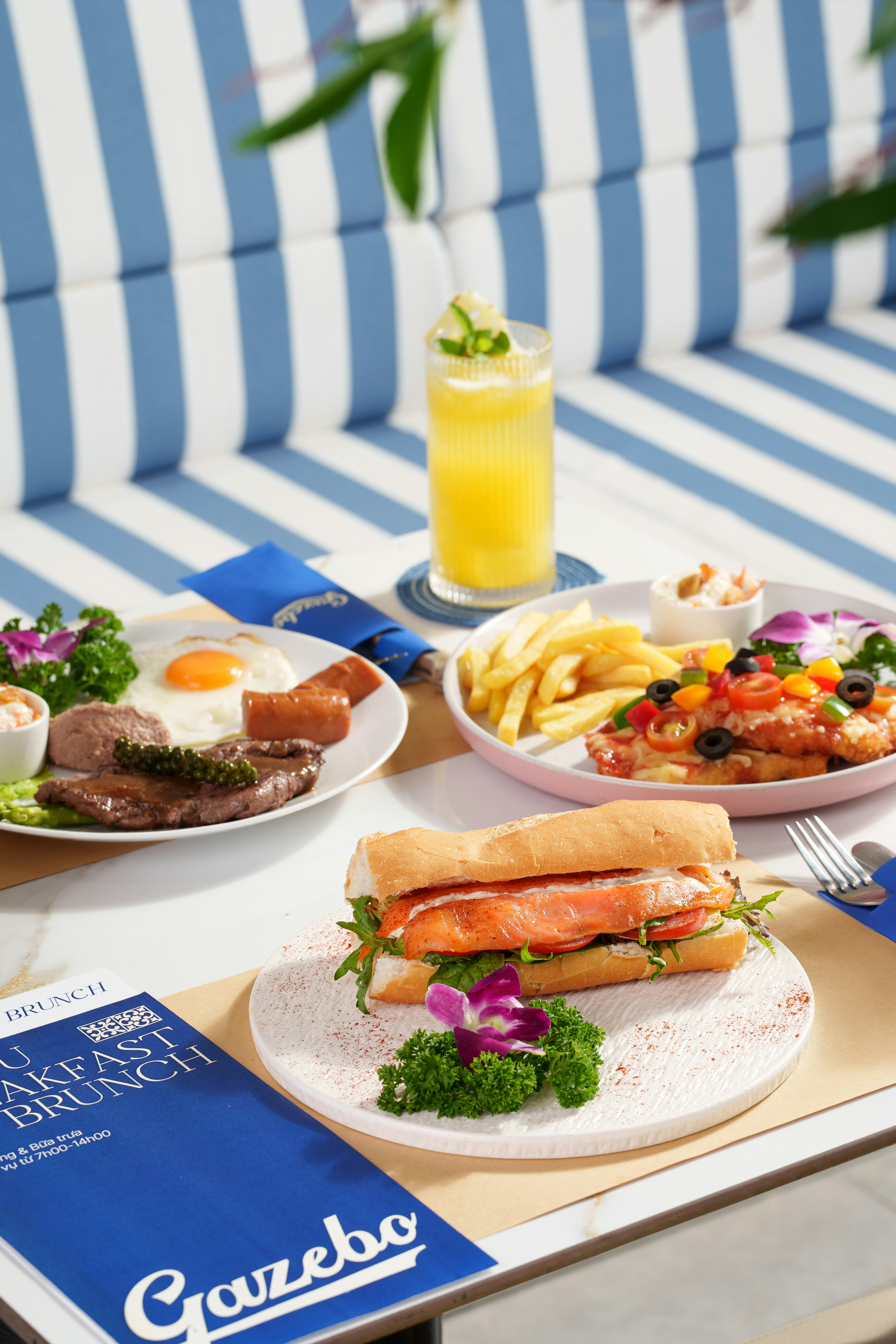 Shrimp sandwich anchors a sunlit poolside brunch spread