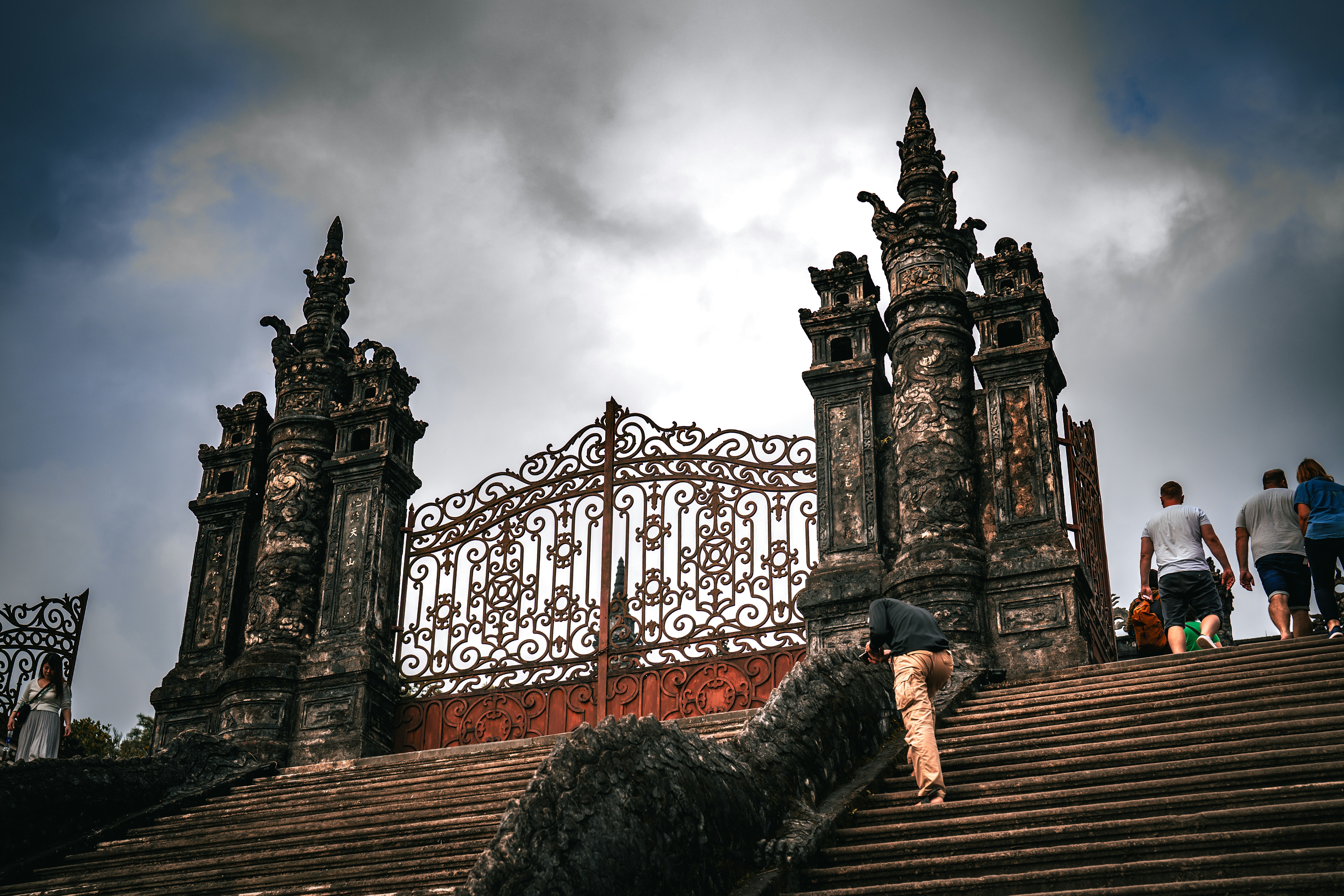 Ascending to the Iron Gate: Weathered Staircase Framed by Sky and Stone