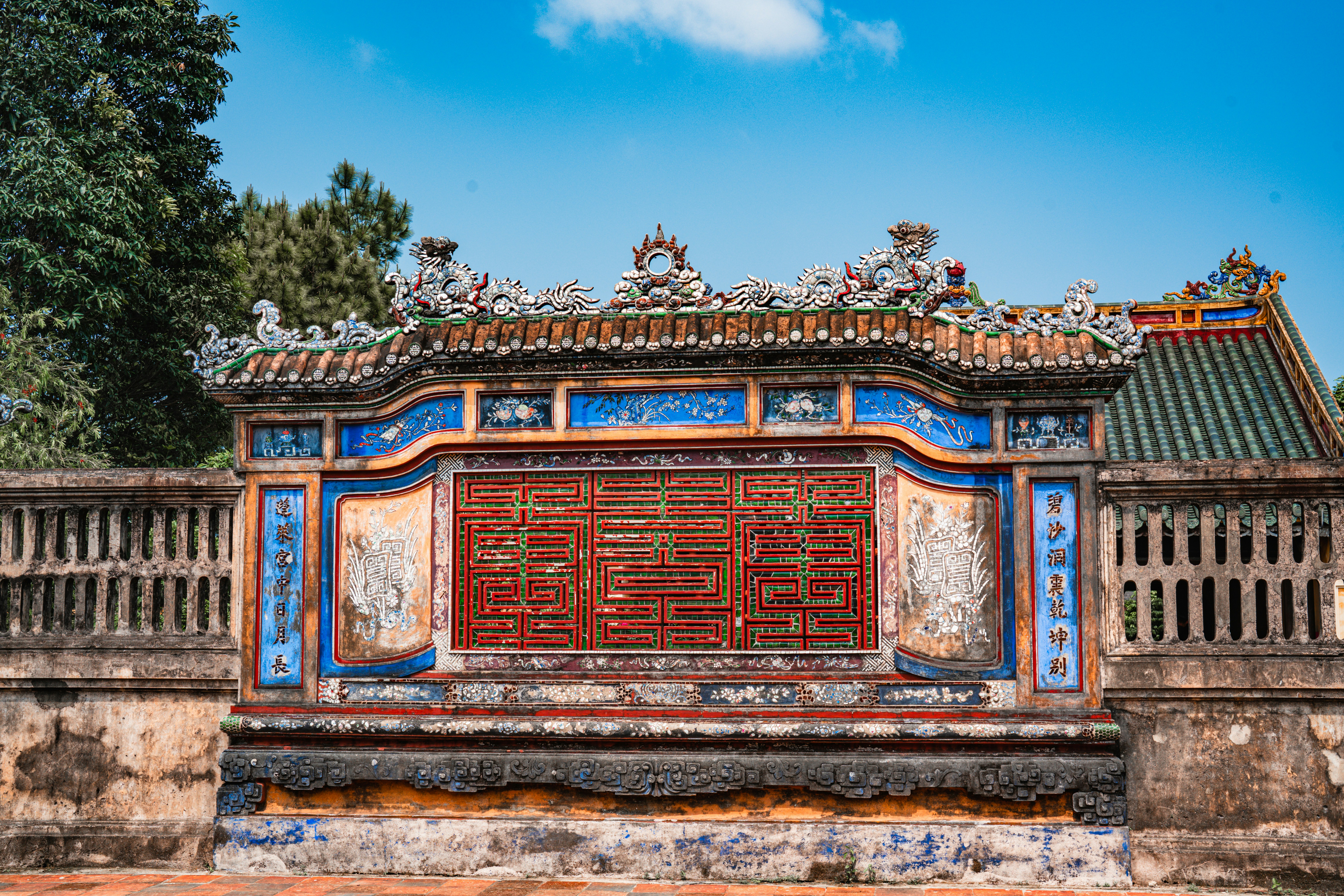Carved Dragon Gate: A Weathered Temple Wall in Vivid Detail