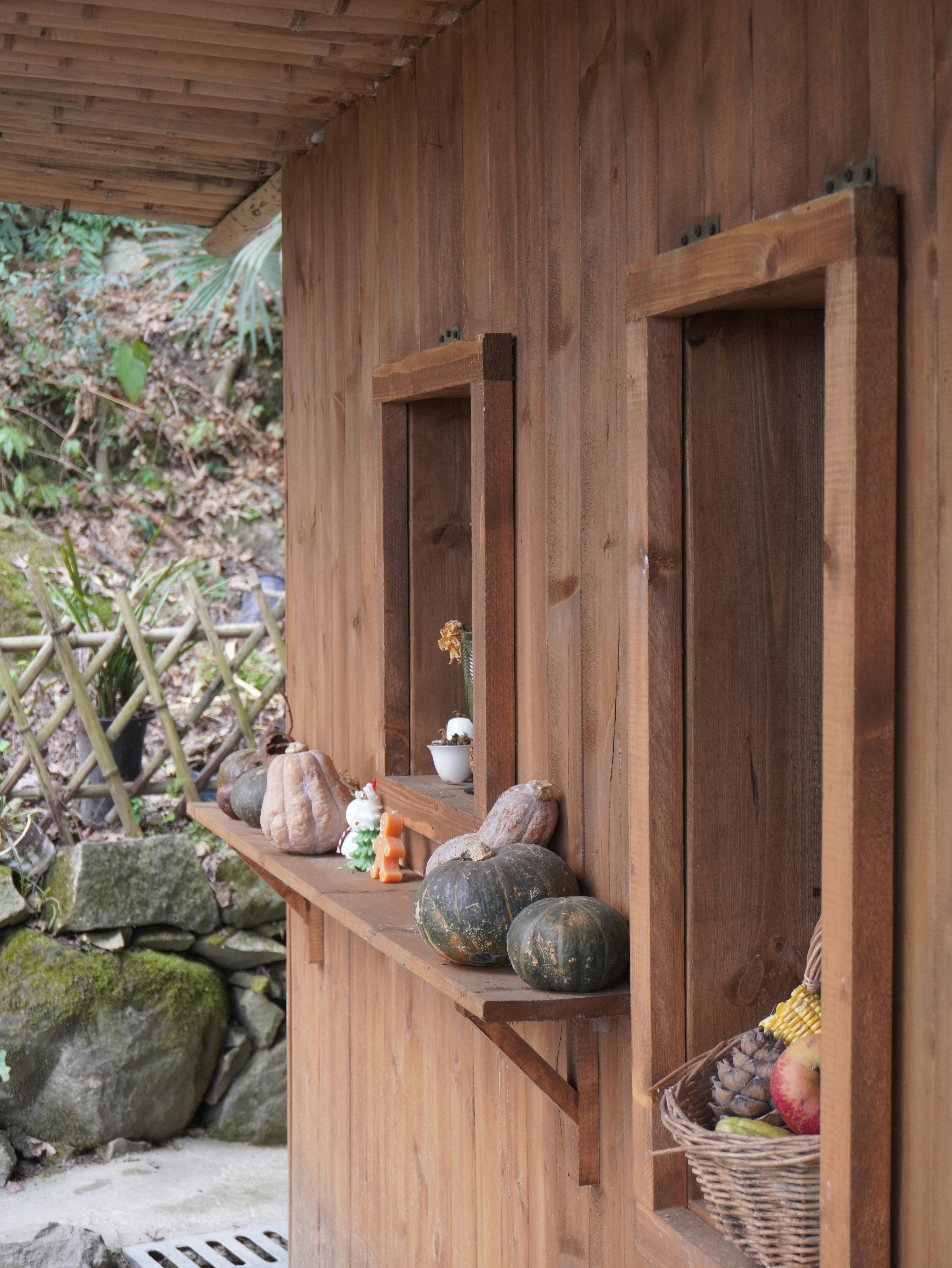 Rustic Nook Shrine: Pumpkins, Figurines, and a Garden Altar on Weathered Wood