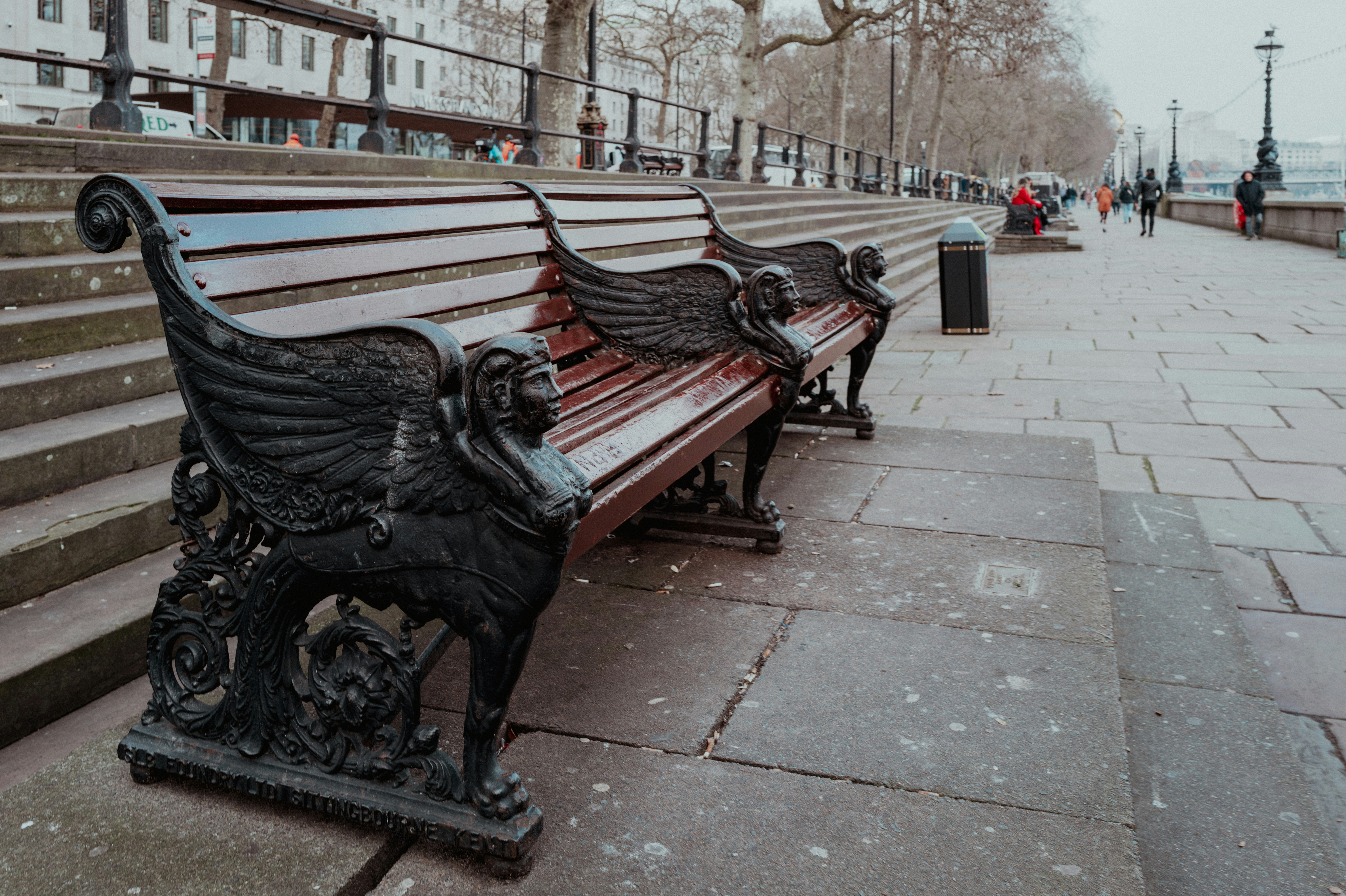Winged-Lion Benches Guard a Winter Riverside Walk