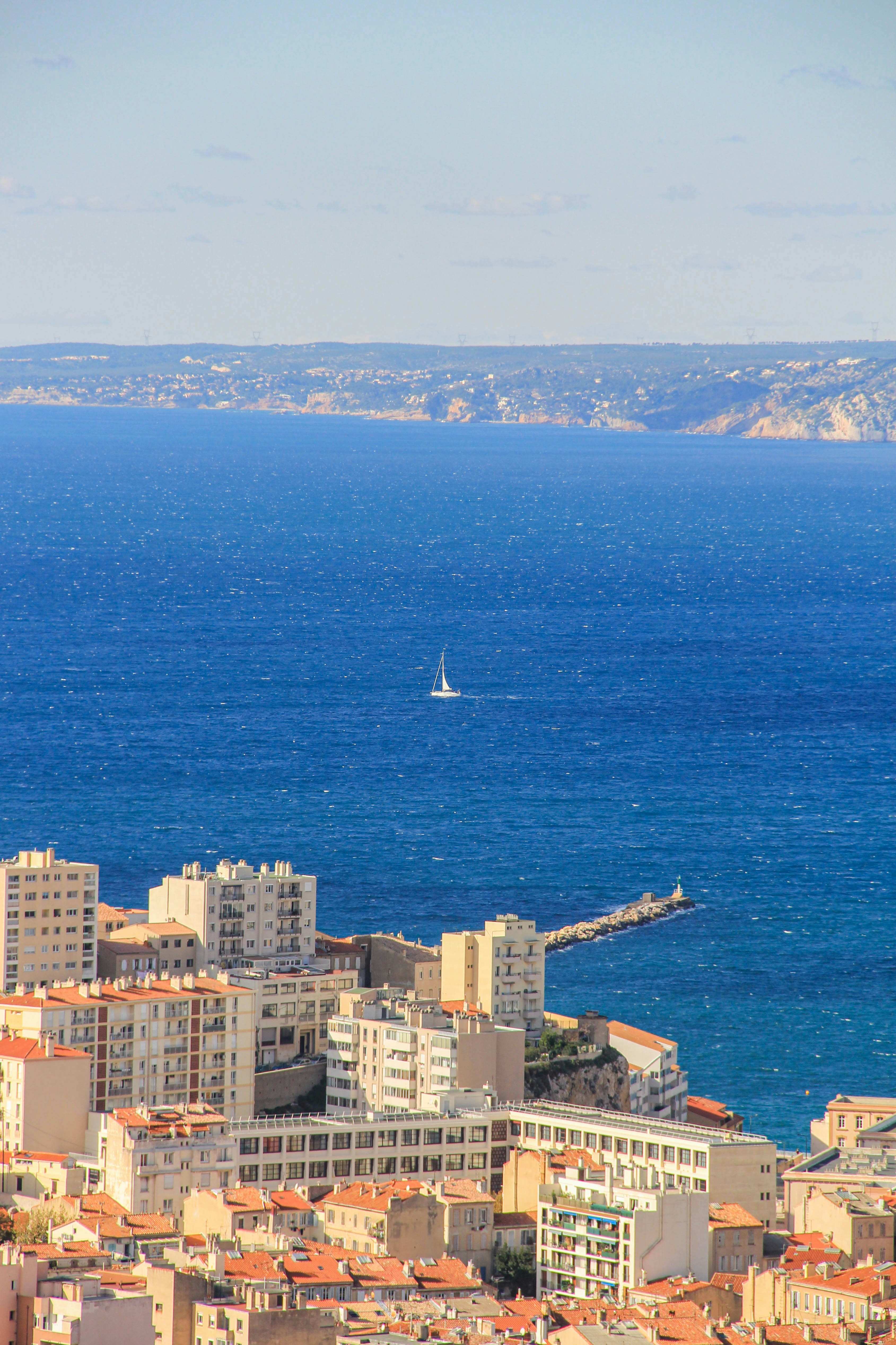 Solitary Sail on the Azure Horizon