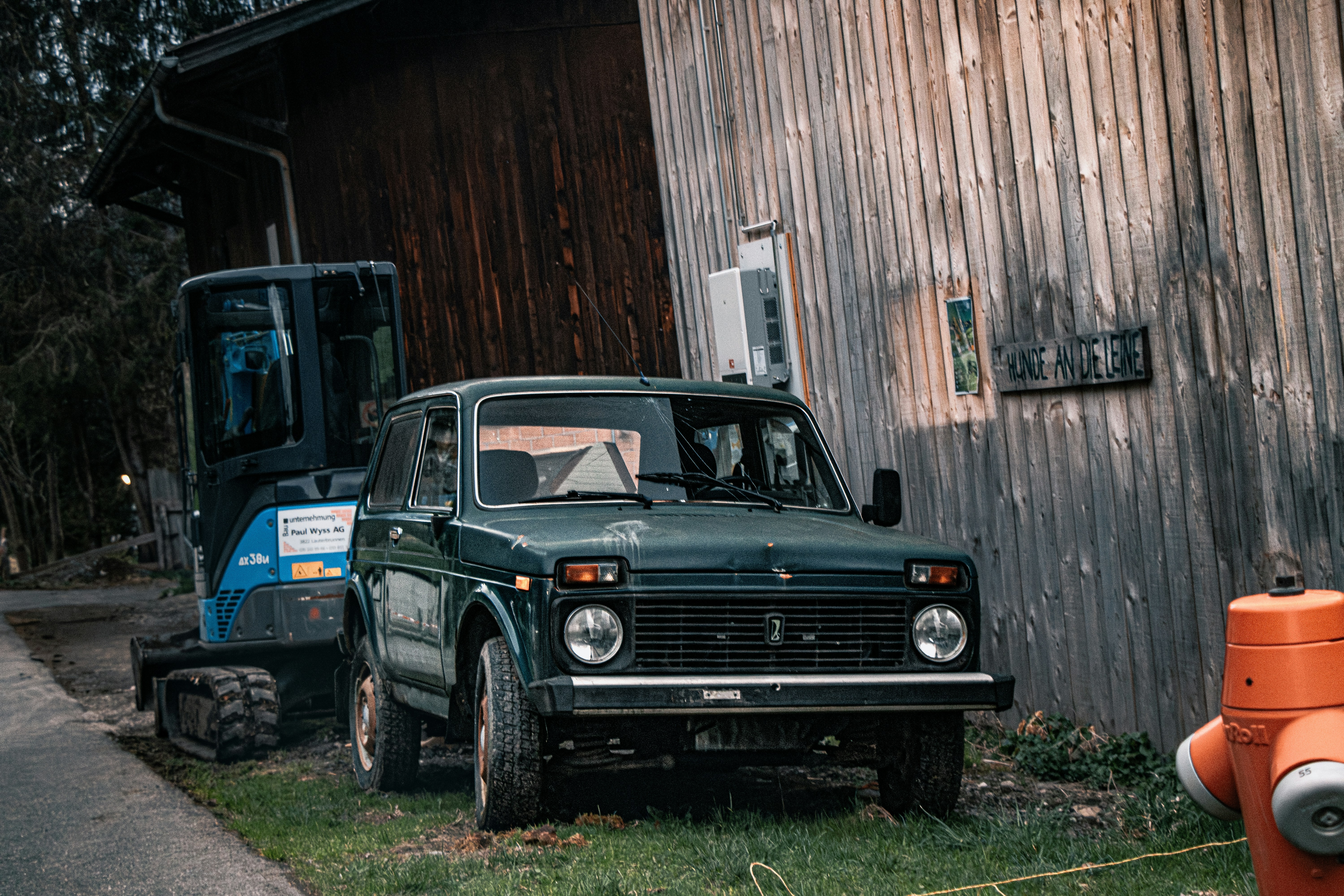 Rustic Charm: A Green Classic Amidst Modern Machinery