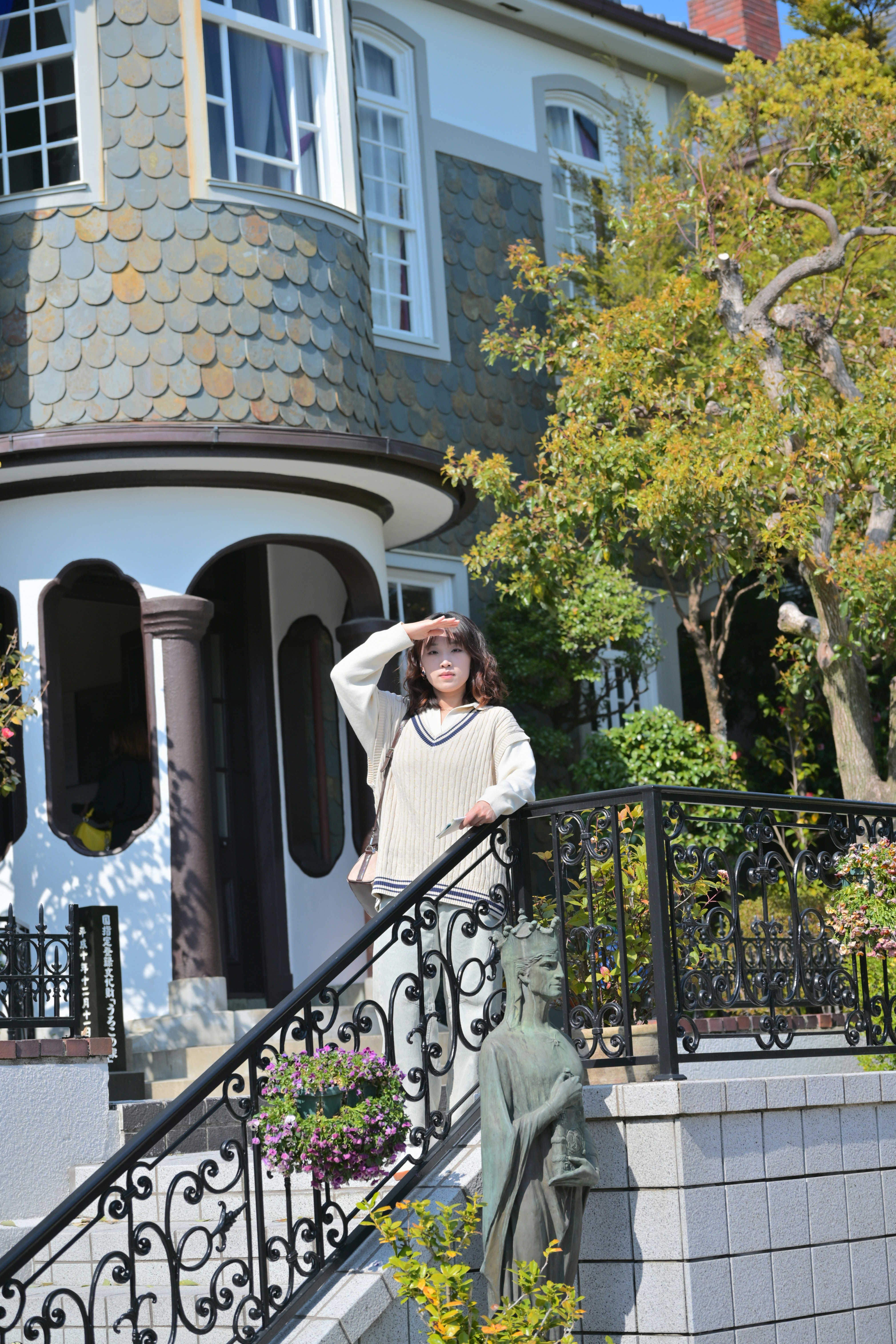 Portrait on the Curved Staircase of a Shingle-Tiled Villa