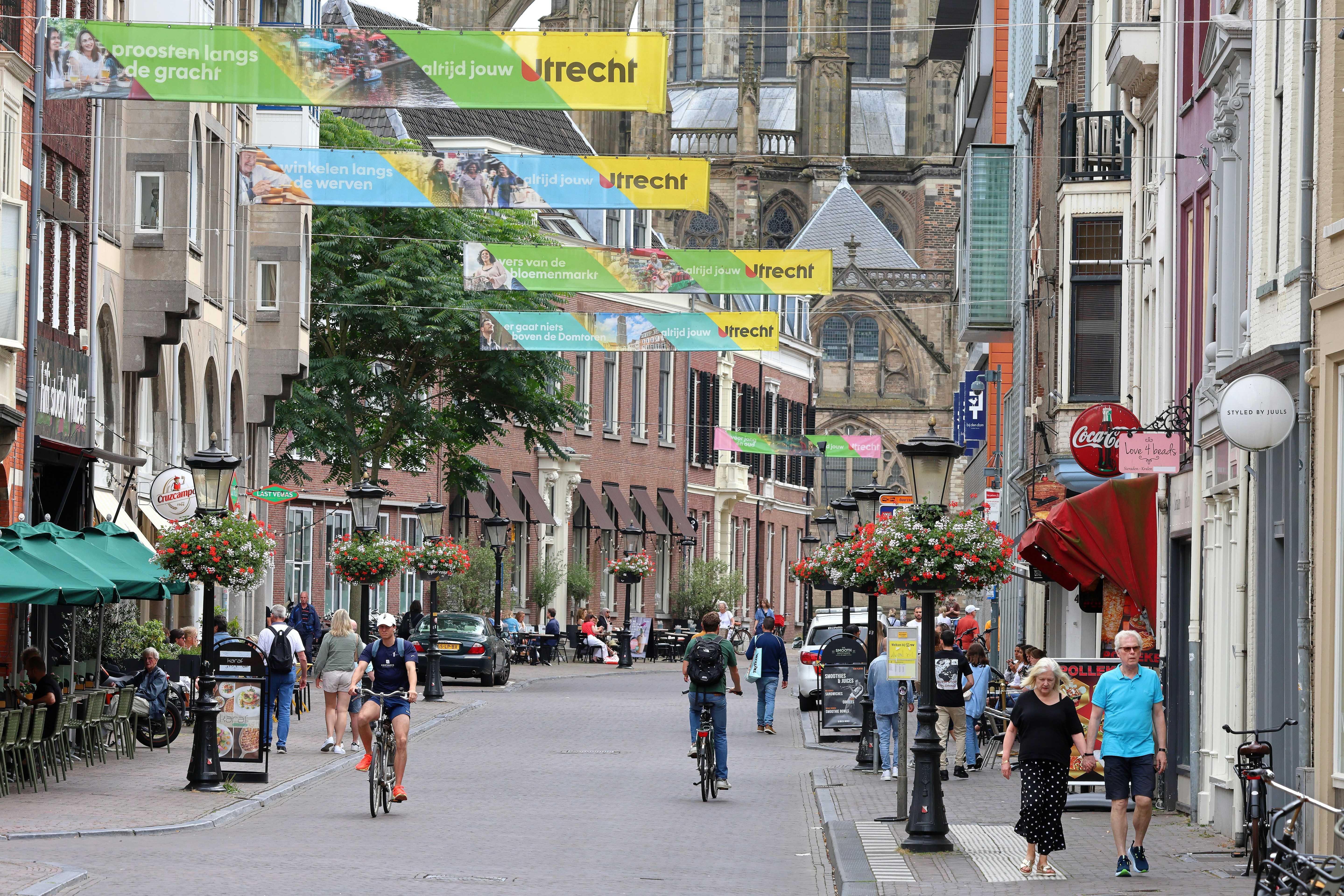 Vibrant Street Life Under Colorful Banners