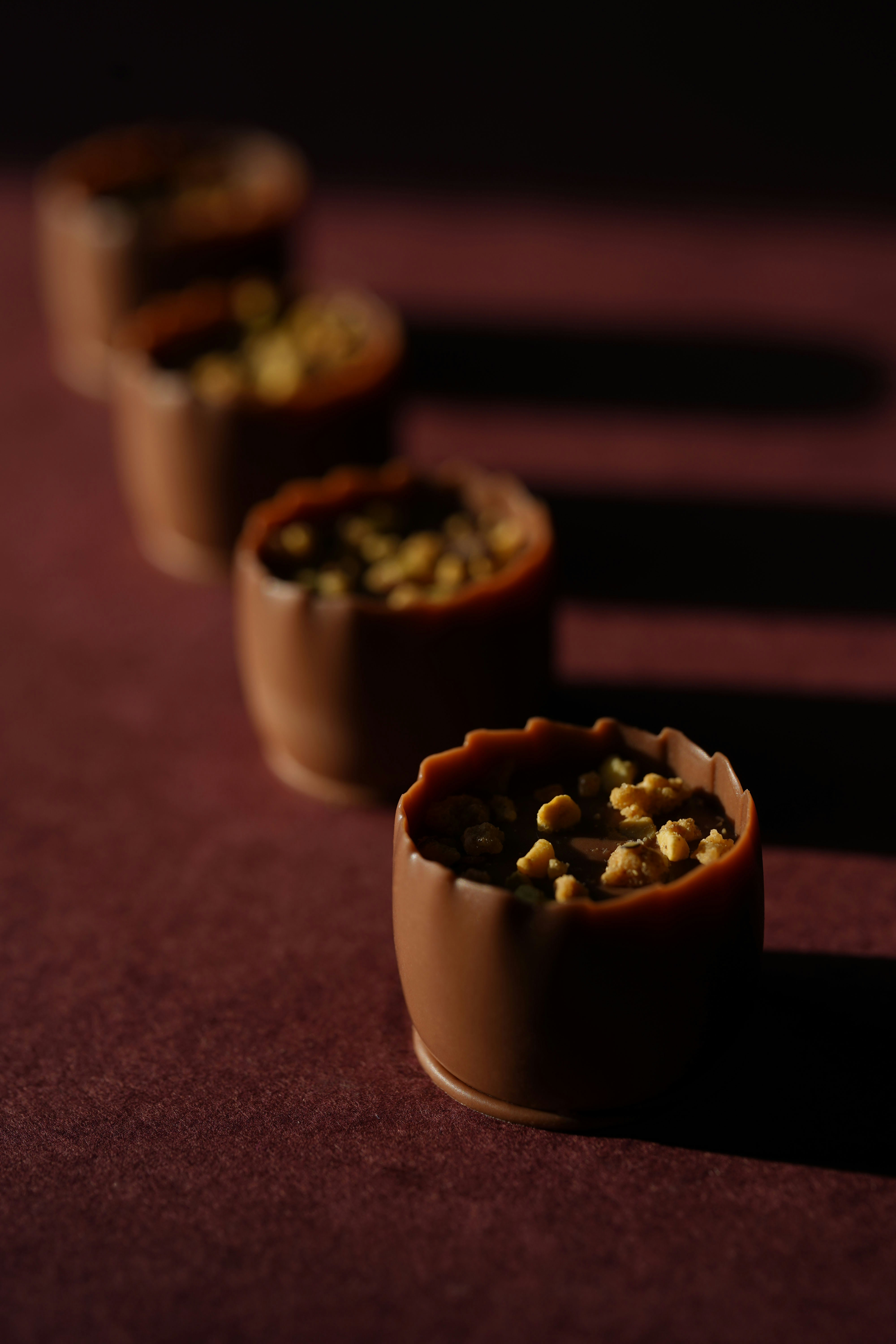 Chocolate candies sit in a row. photo – Free Food Image on Unsplash