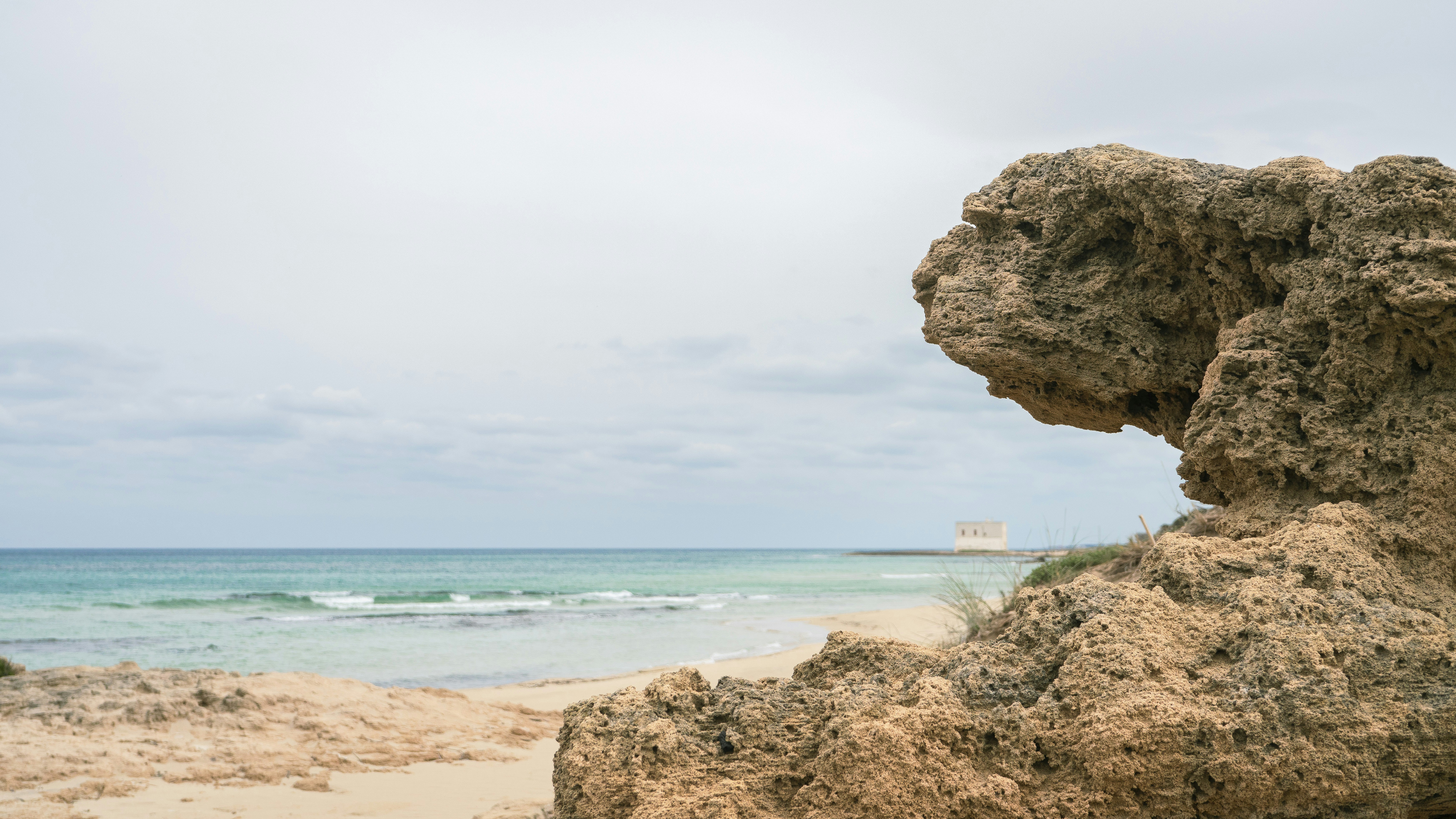 Rocky foreground overlooks a serene beach and ocean. photo – Free Beach ...
