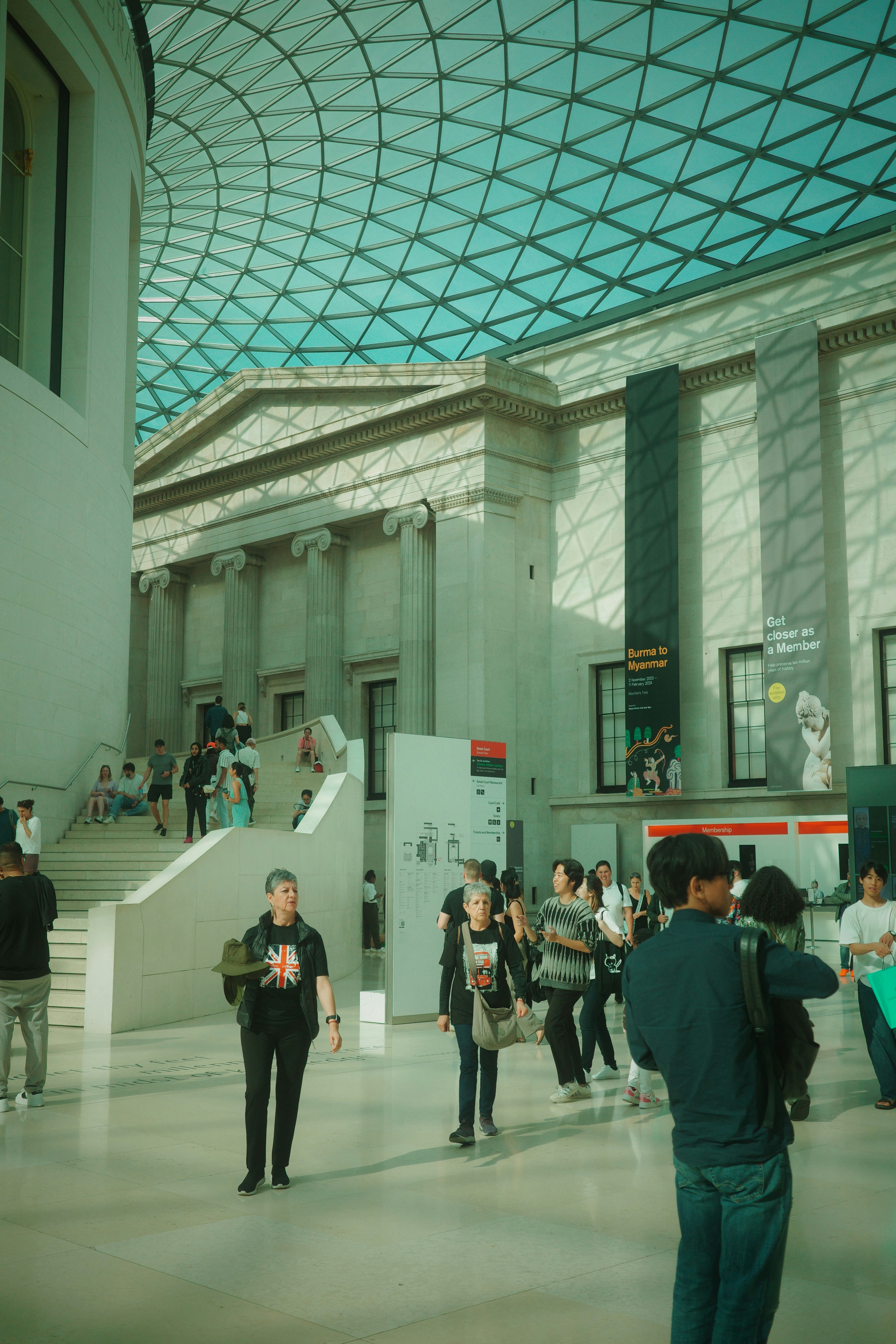 Museum Atrium: Light and Shadow Across Gridded Glass Ceiling