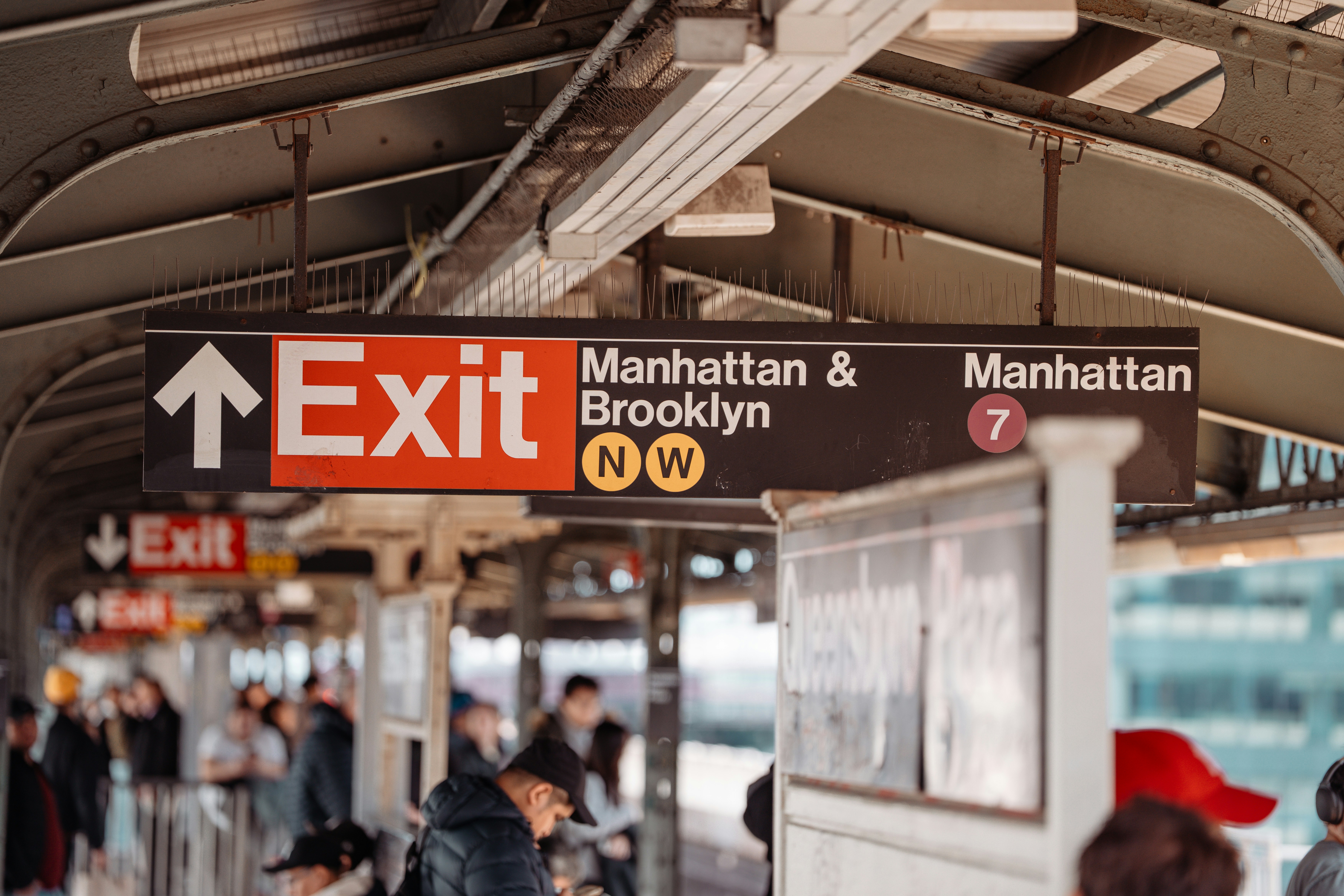 Subway sign indicating an exit to manhattan and brooklyn. photo – Free ...