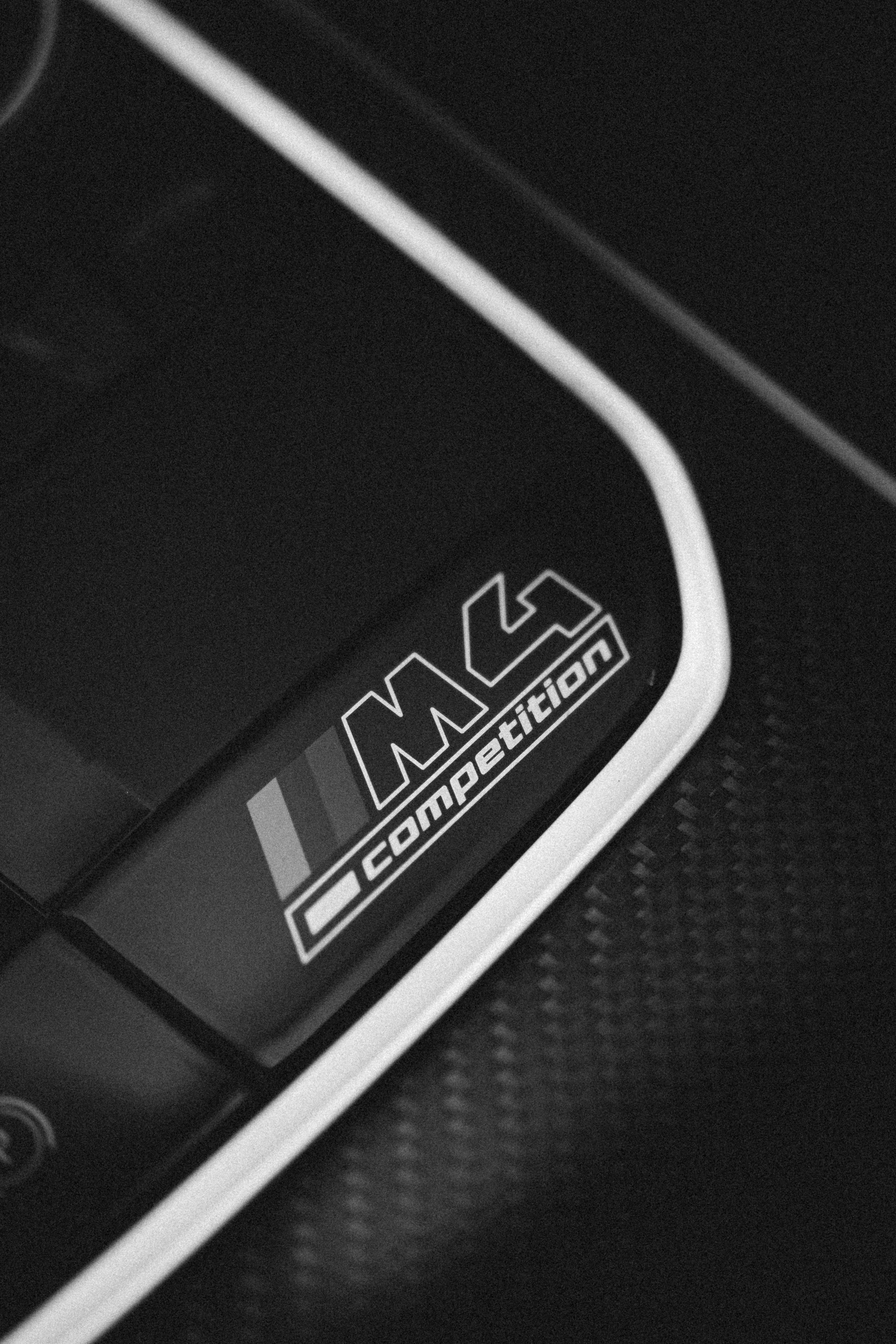 The BMW m4 competition emblem is displayed. photo – Free Car Image on ...