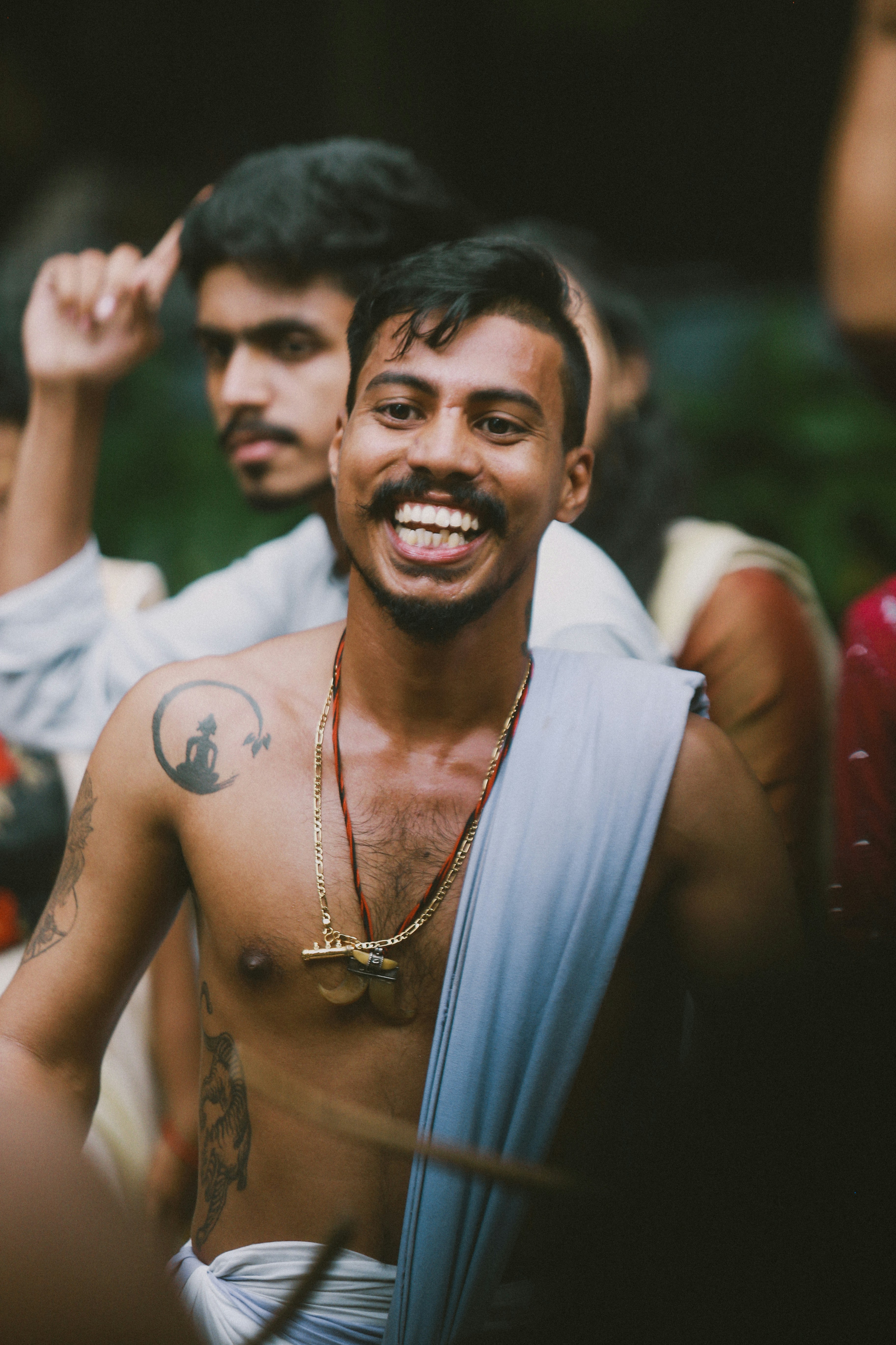 A joyful man smiles, celebrating with others. photo – Free Celebration ...