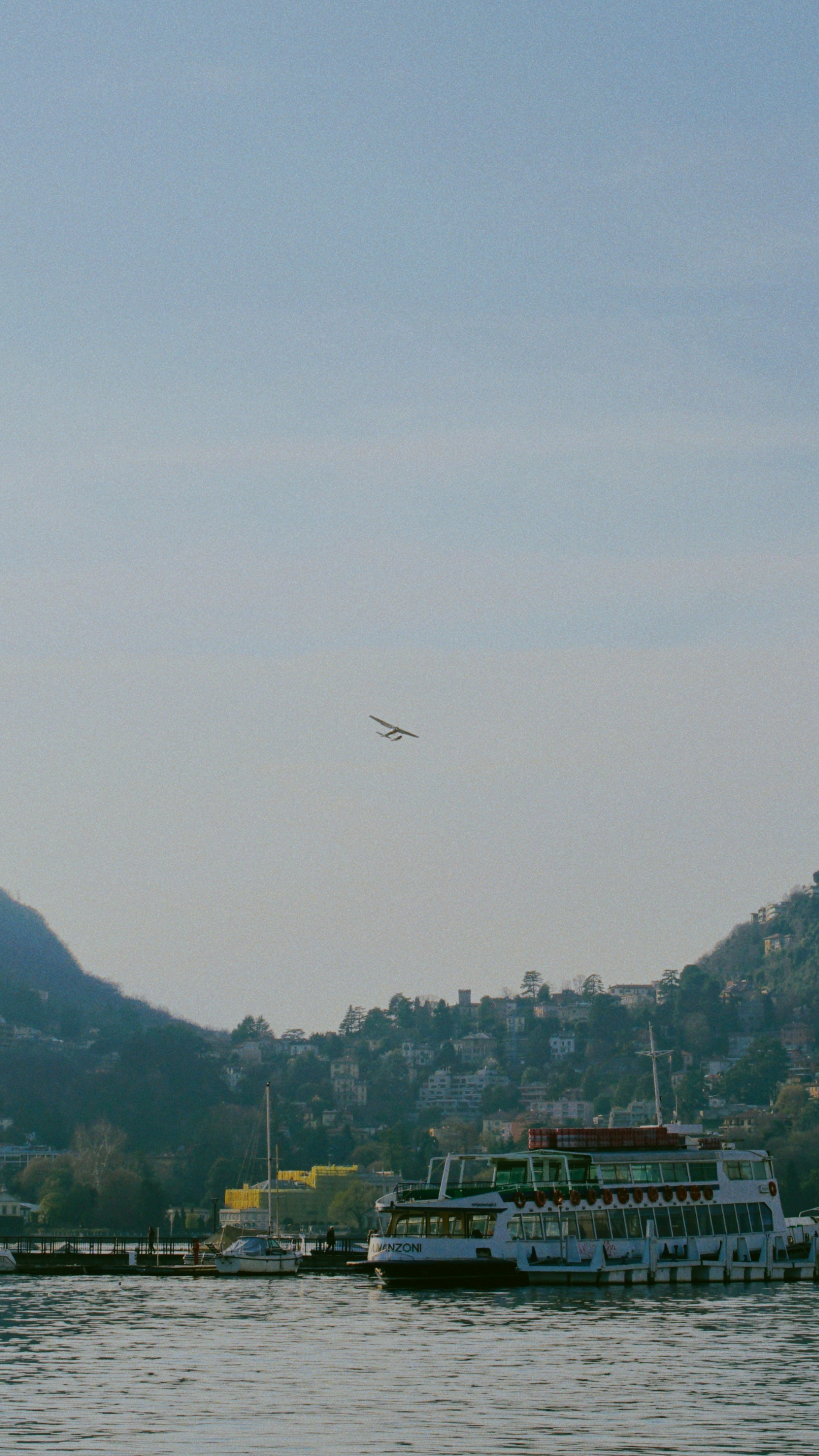 A lone glider over the waterfront village