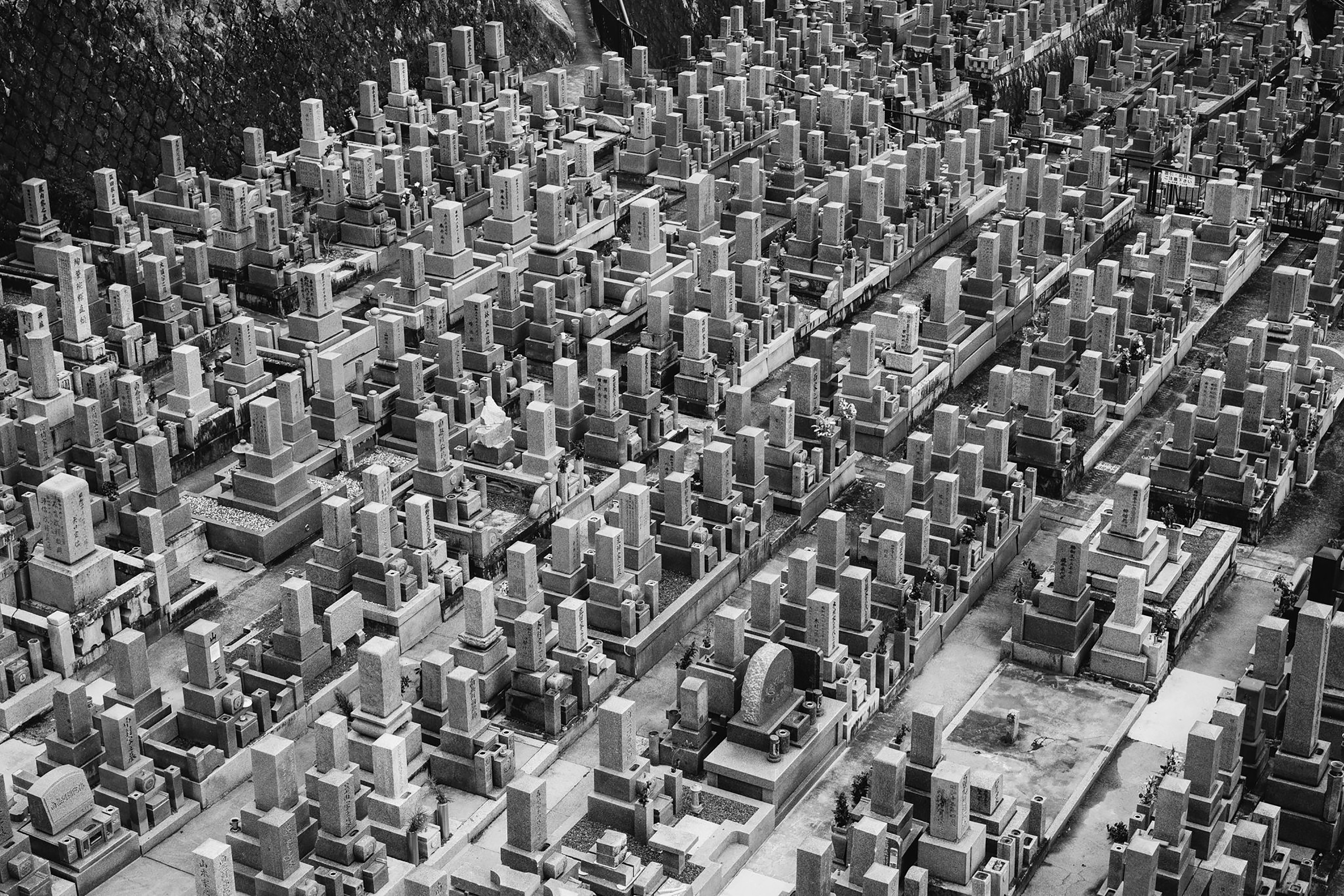 A cemetery is filled with many tombstones. photo – Free Aerial view ...