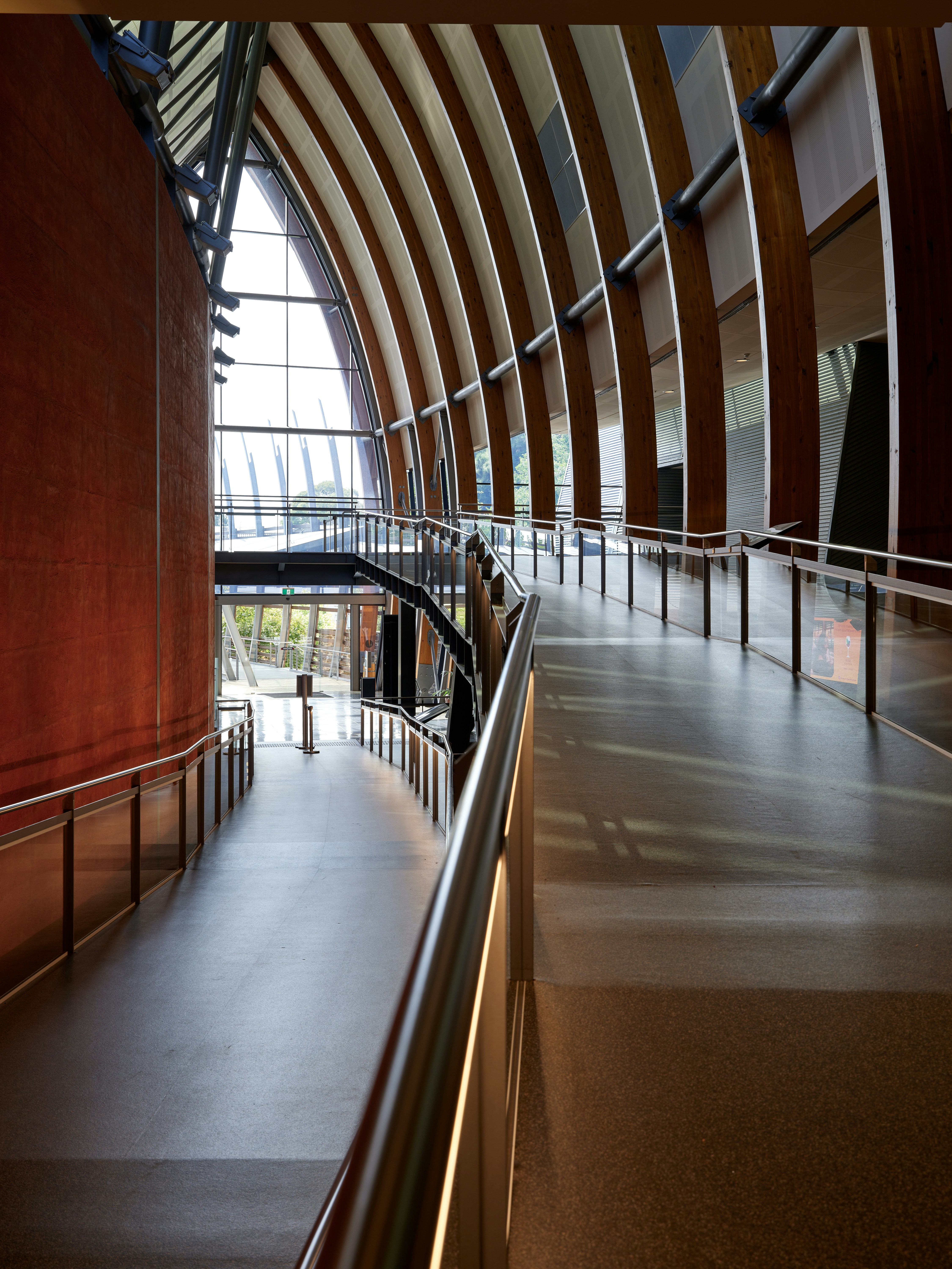 A modern interior walkway with an arching ceiling. photo – Free City ...