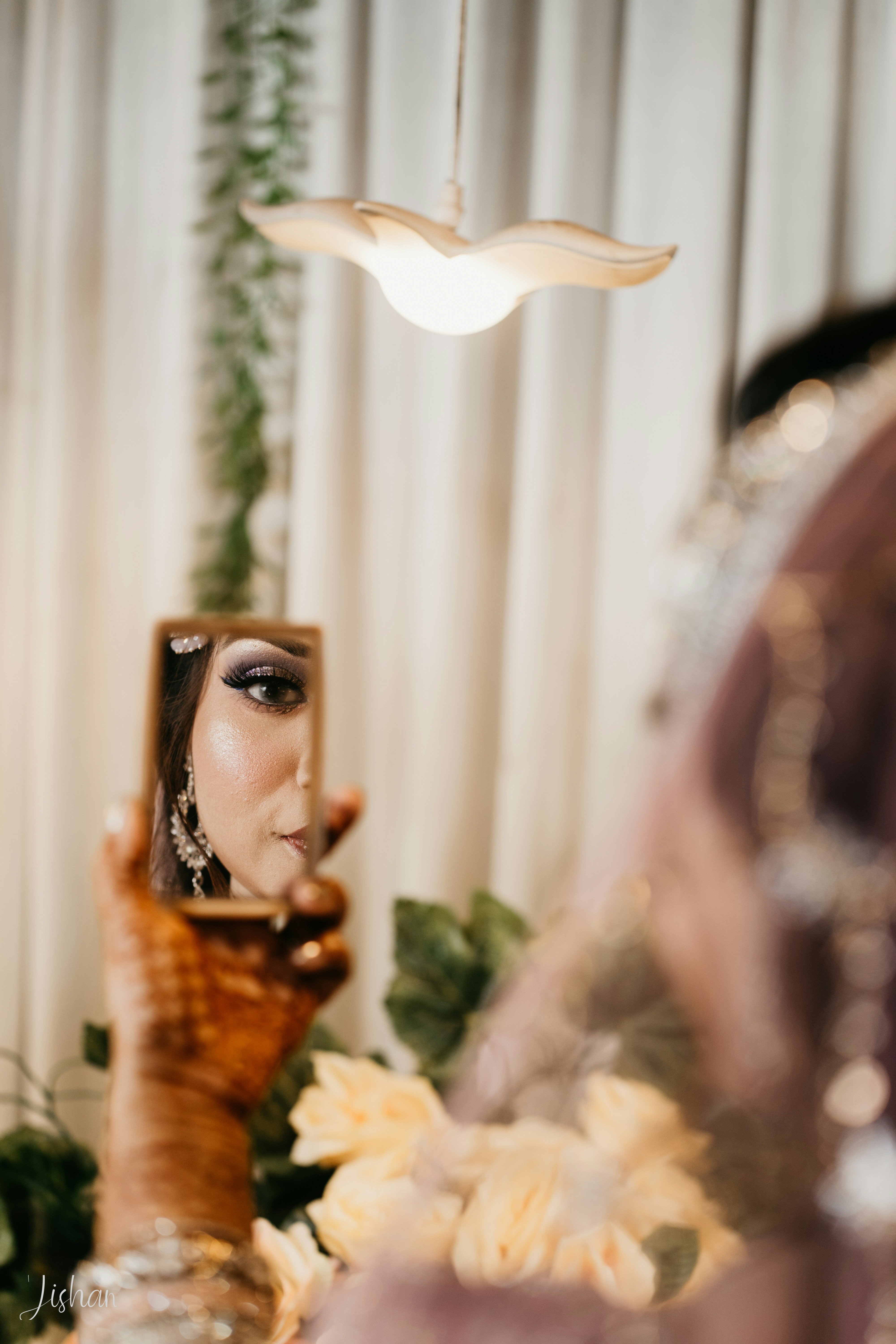 A bride looks at her reflection in a mirror. photo – Free Face Image on ...