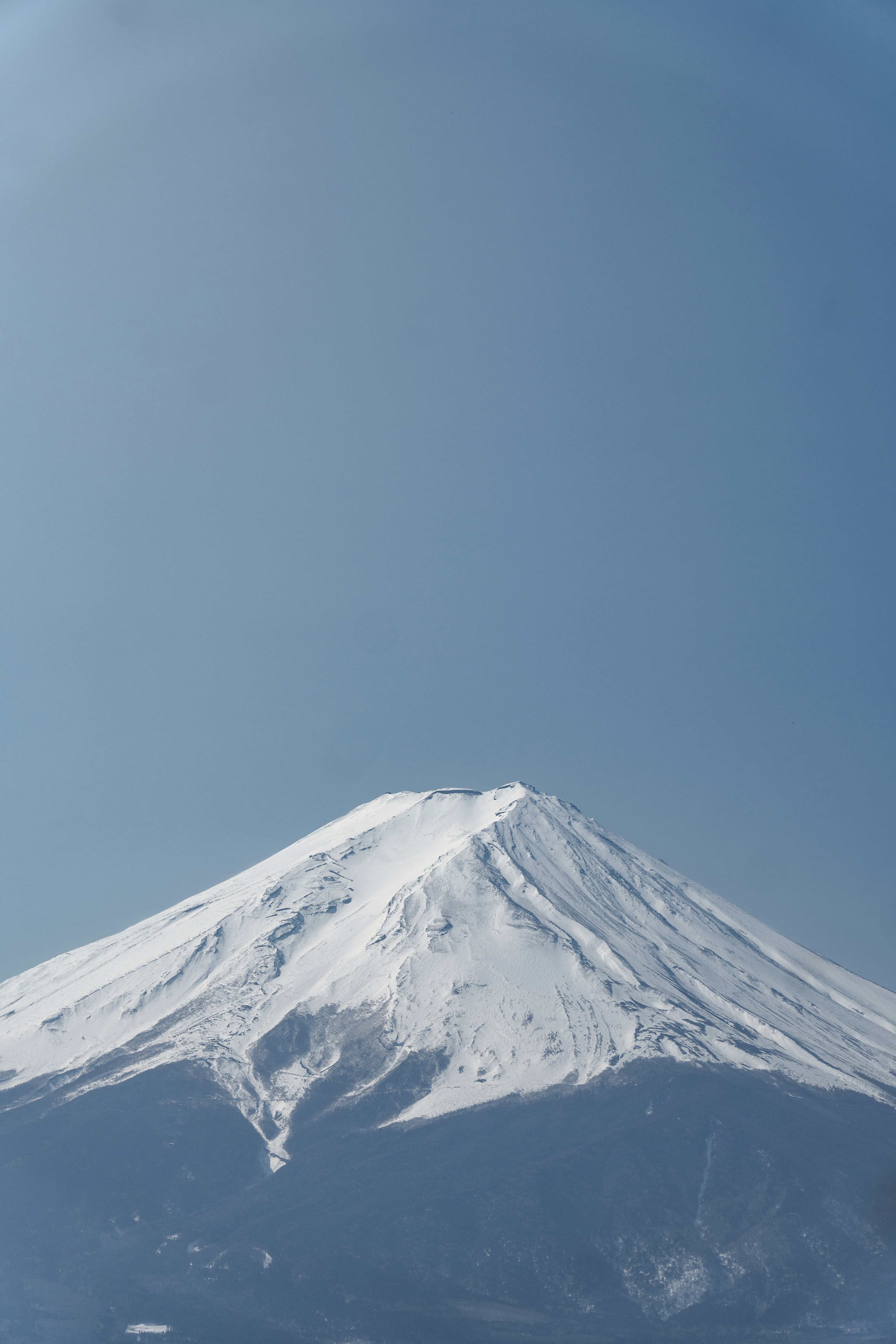 Snow-capped mount fuji under a clear blue sky. photo – Free Snow Image ...