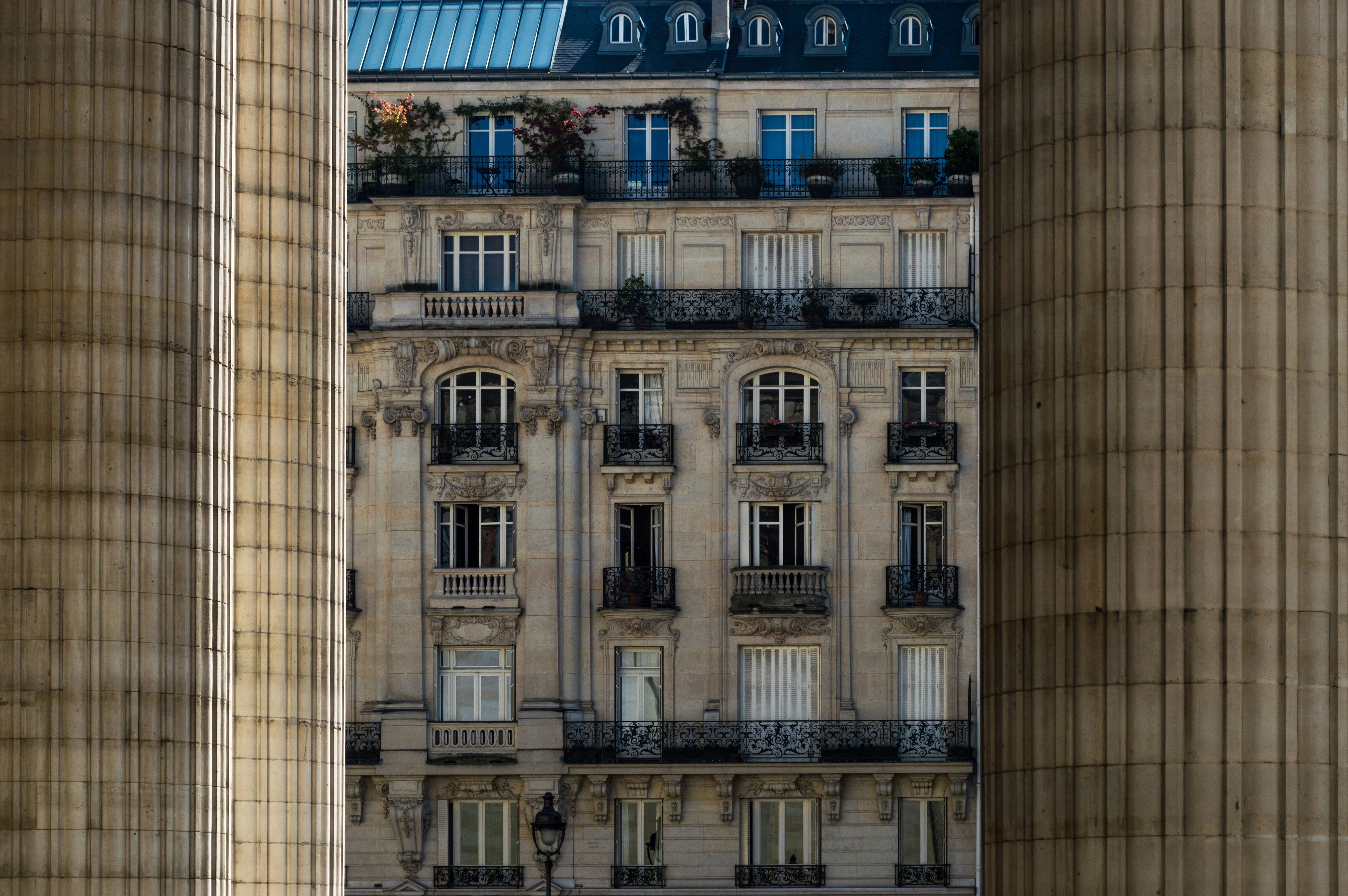 Between Giants: A Parisian Facade Framed by Monumental Columns