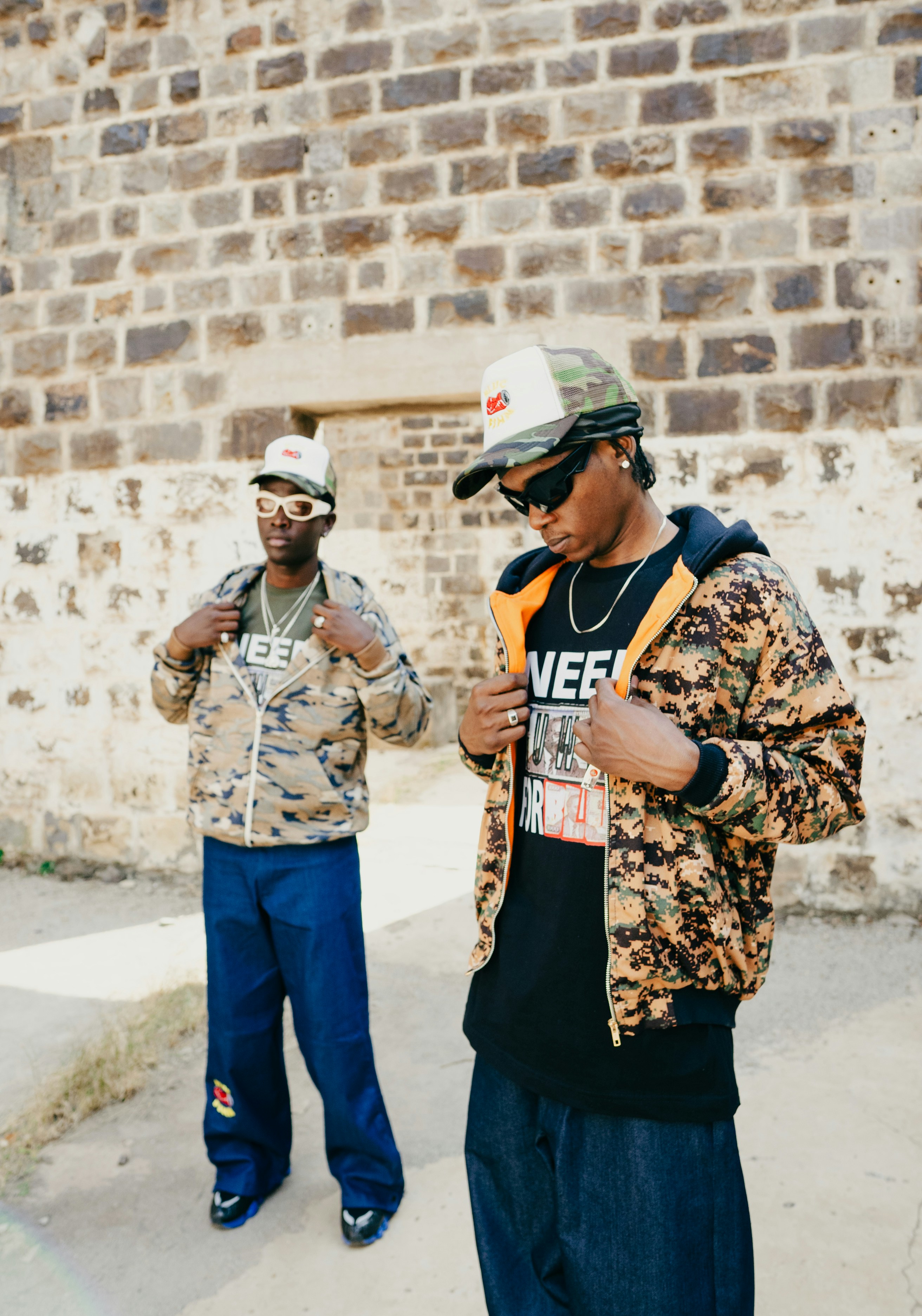 Two men pose for a picture in stylish attire. photo – Free Fashion ...