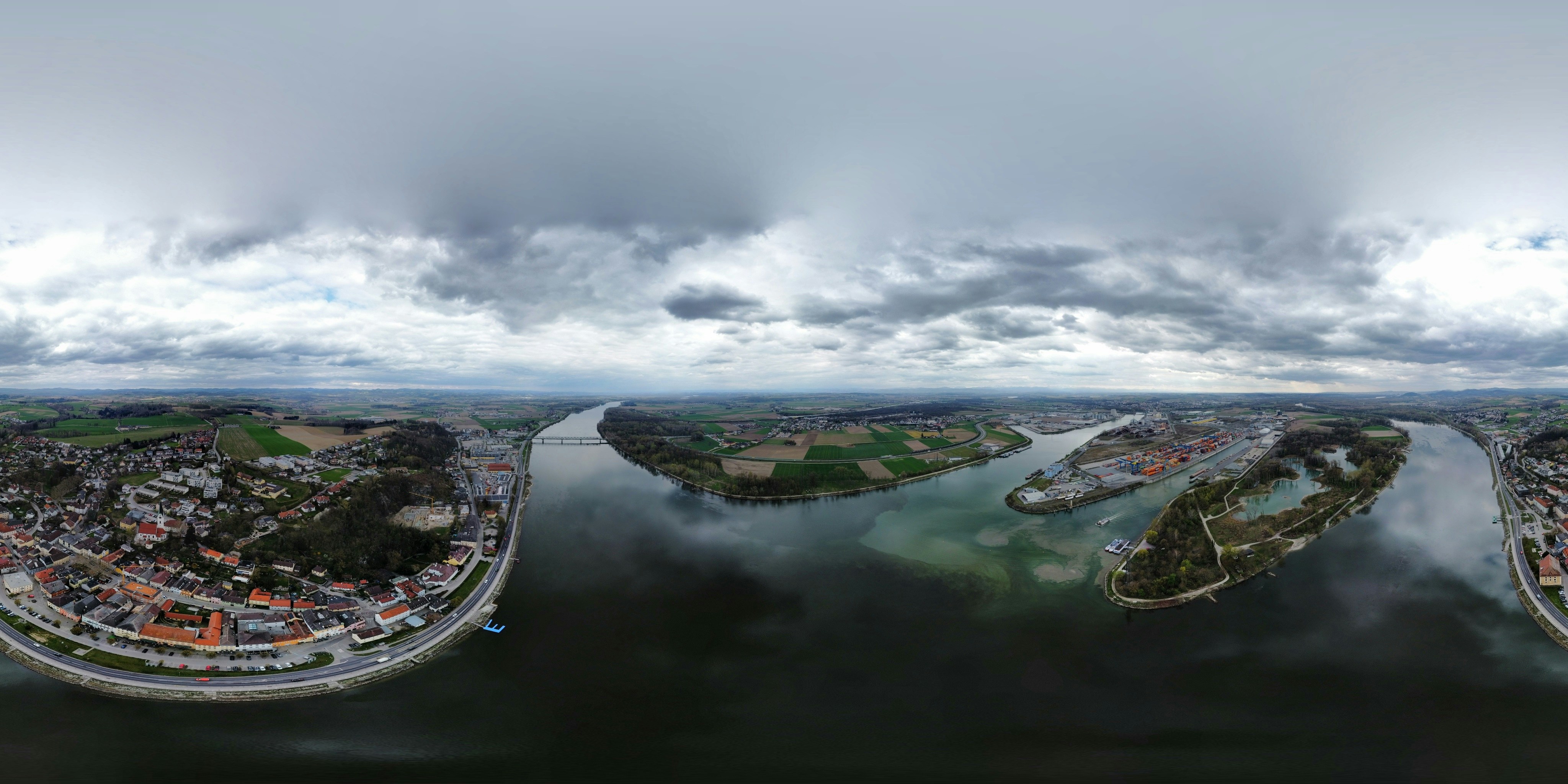 Aerial Confluence: The River Bends Between Townscape and Fields