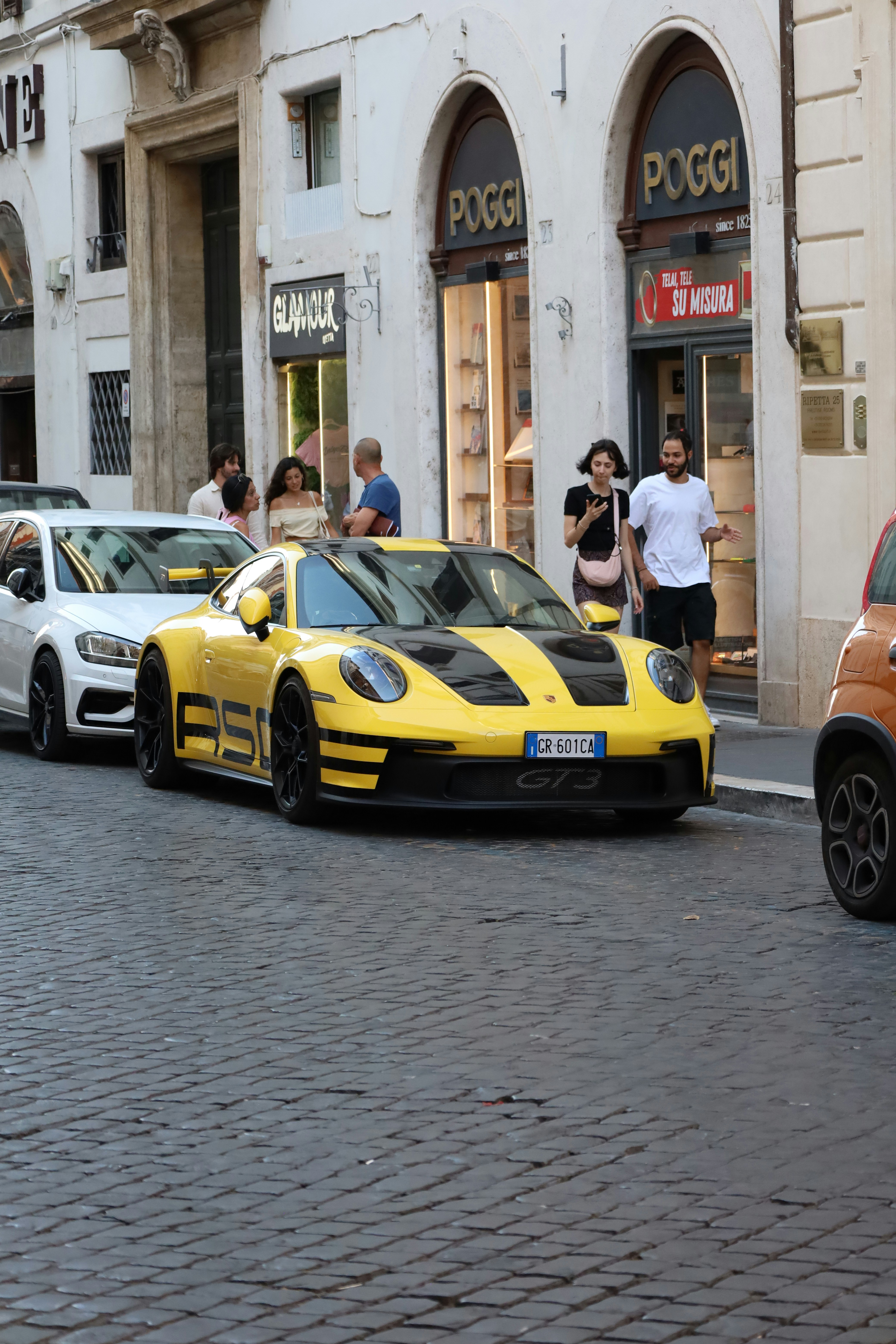 Cobbled Streets, Yellow Porsche GT3: A City Moment in Motion