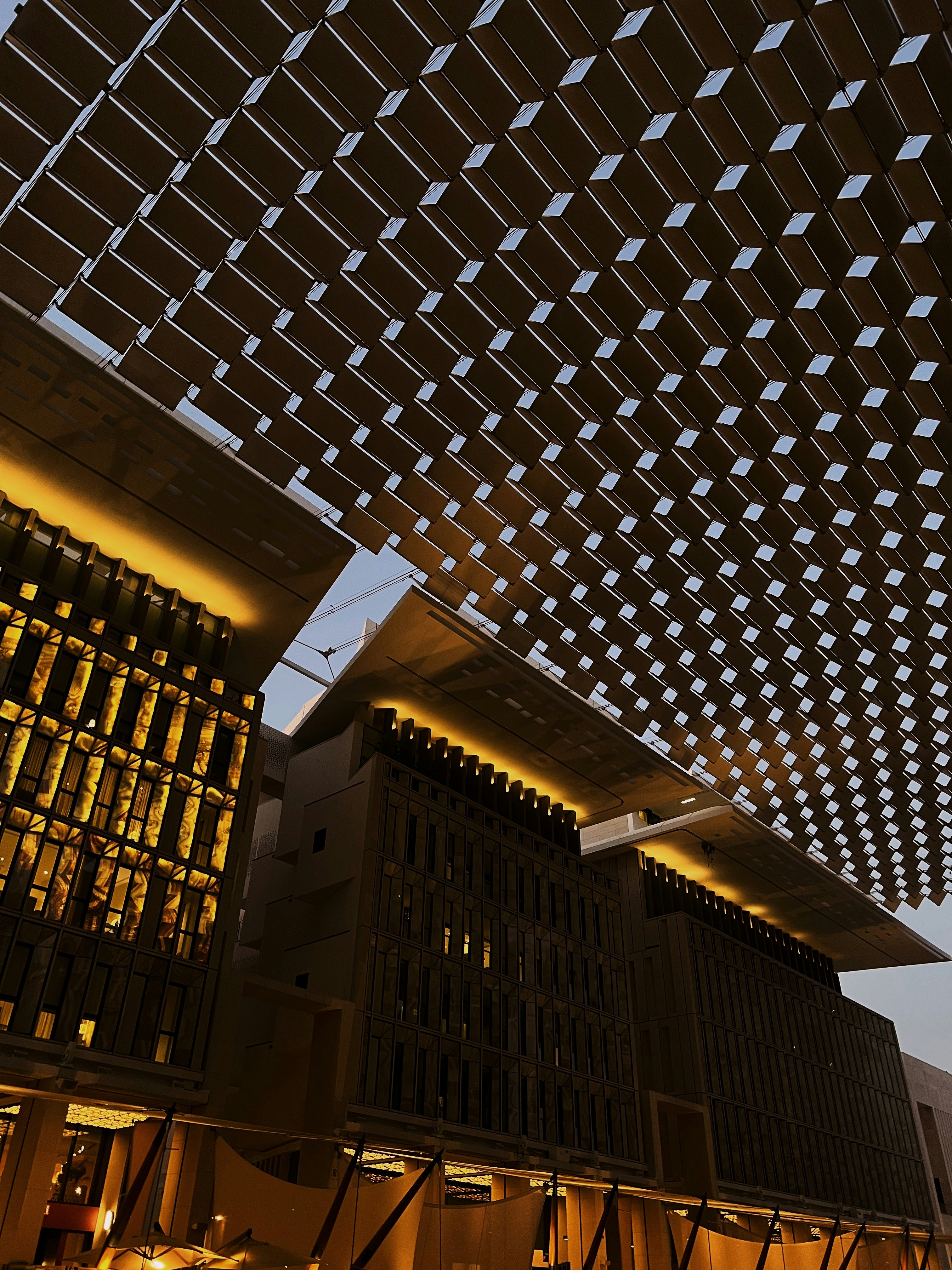 Geometric, shaded structure with intricate building design. photo ...