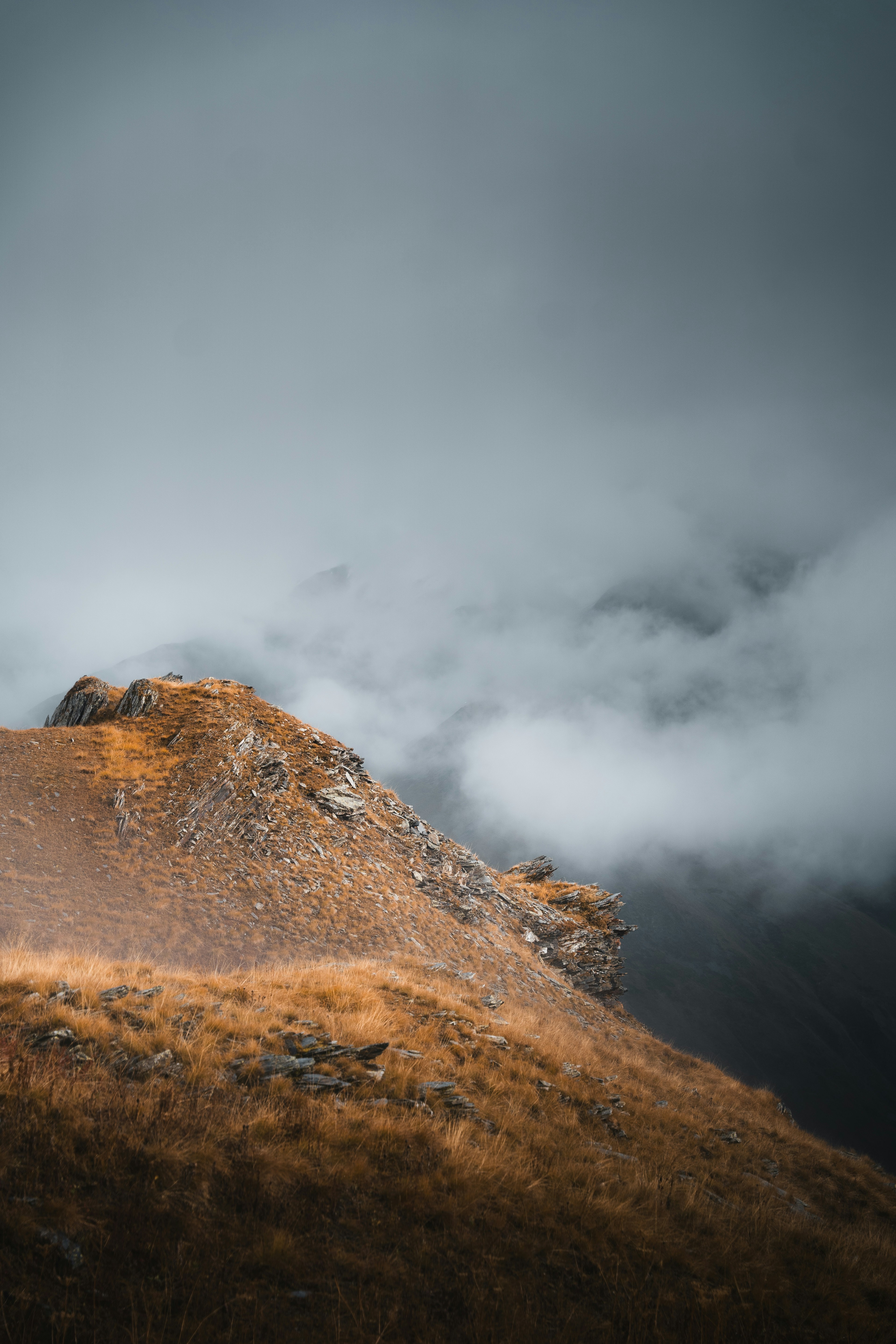 A mountain peak is partially hidden by clouds. photo – Free Wallpaper ...