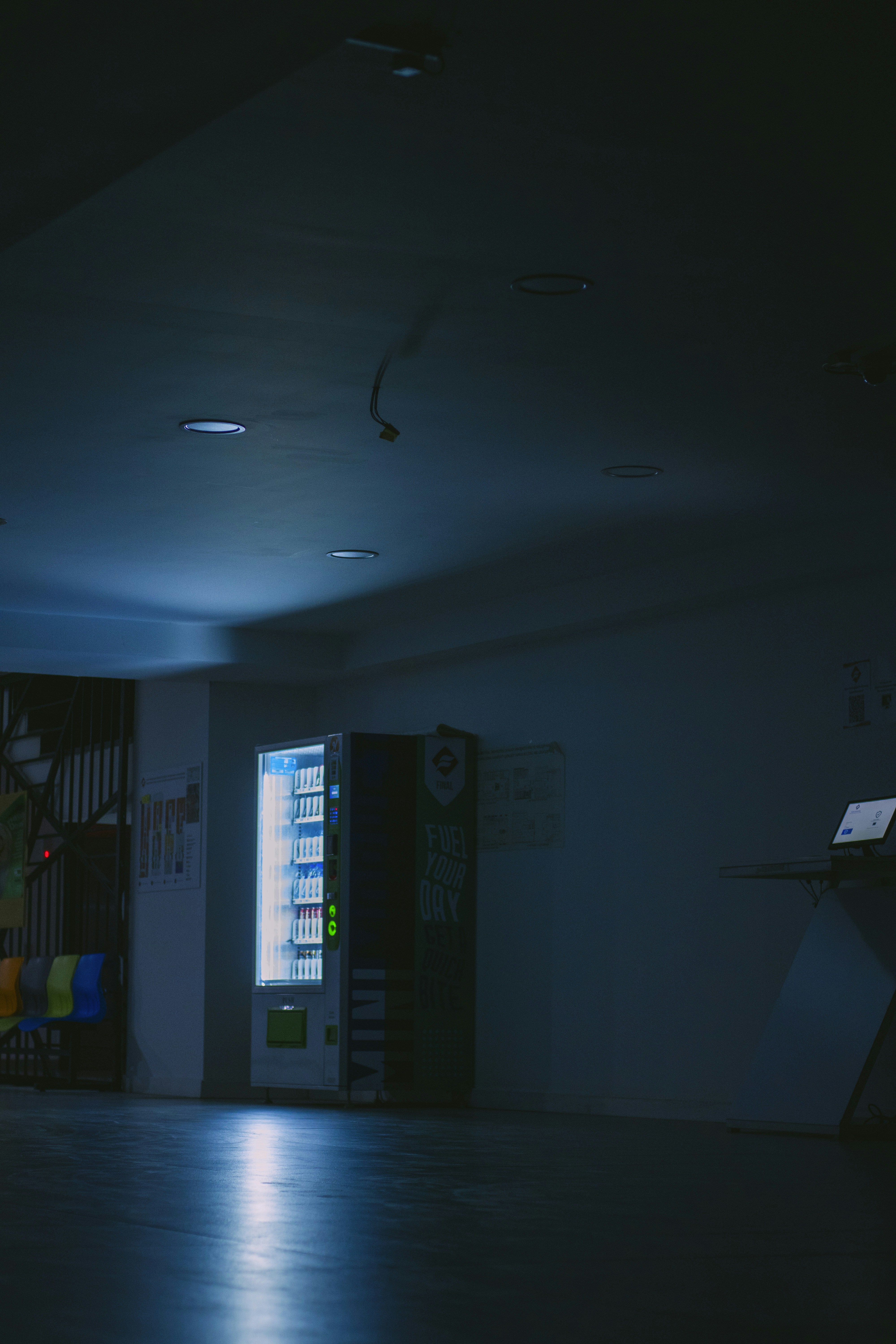 A glowing vending machine illuminates a dark hallway. photo – Free ...