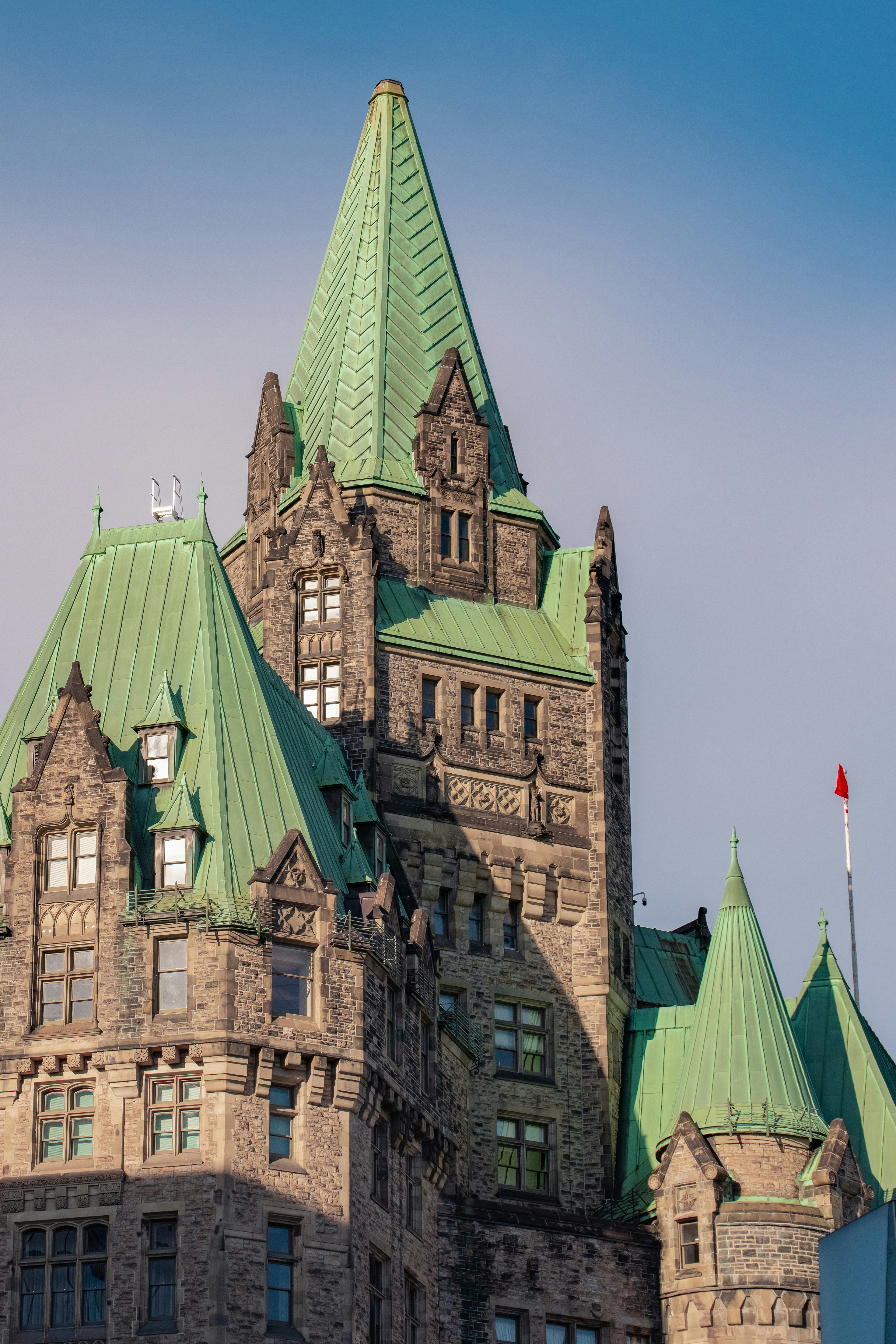 Verdigris Crown: Gothic Towers Rising Over a Stone Bastion