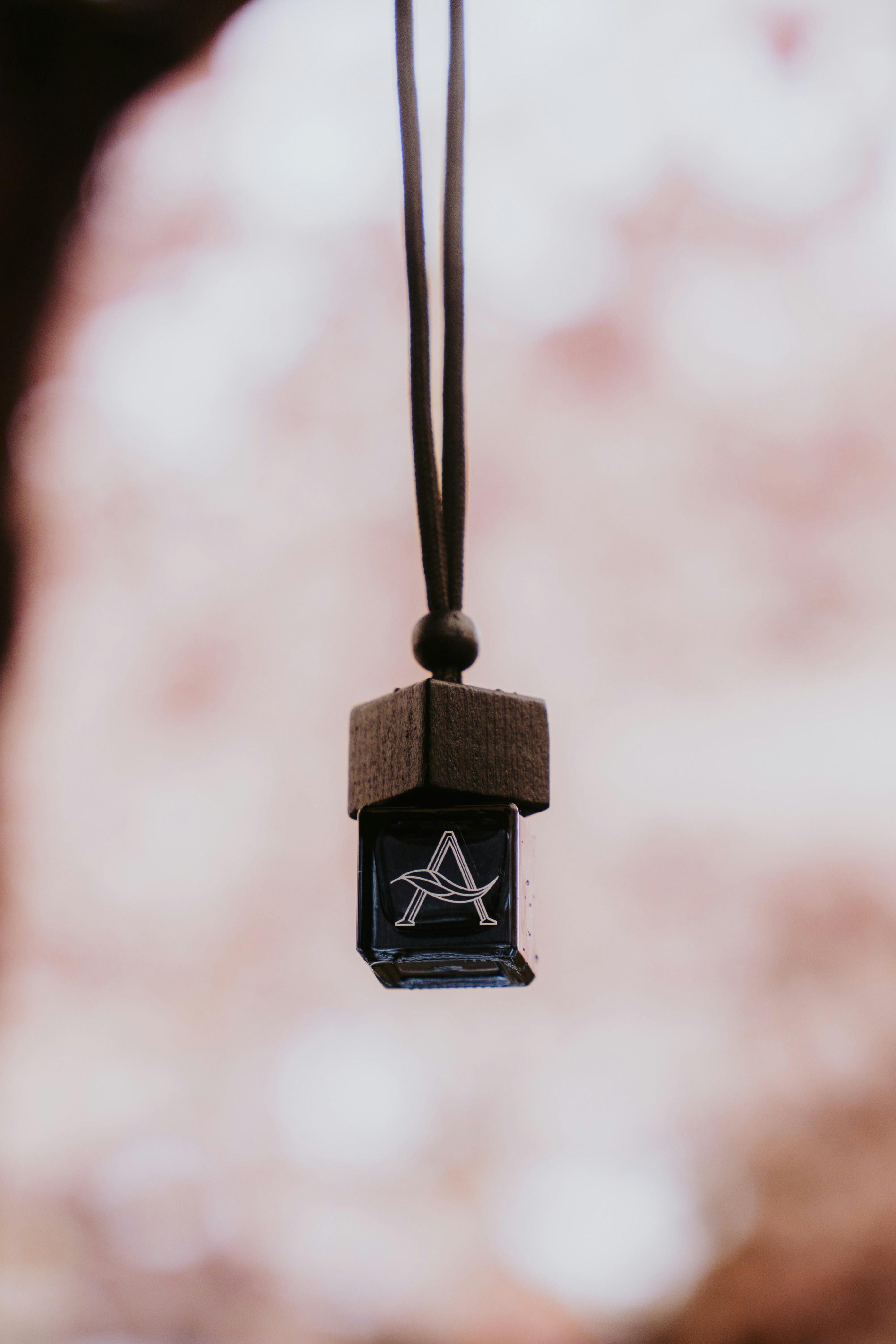 Glyph in Glass: The A Logo Pendant in Soft Pink Bokeh