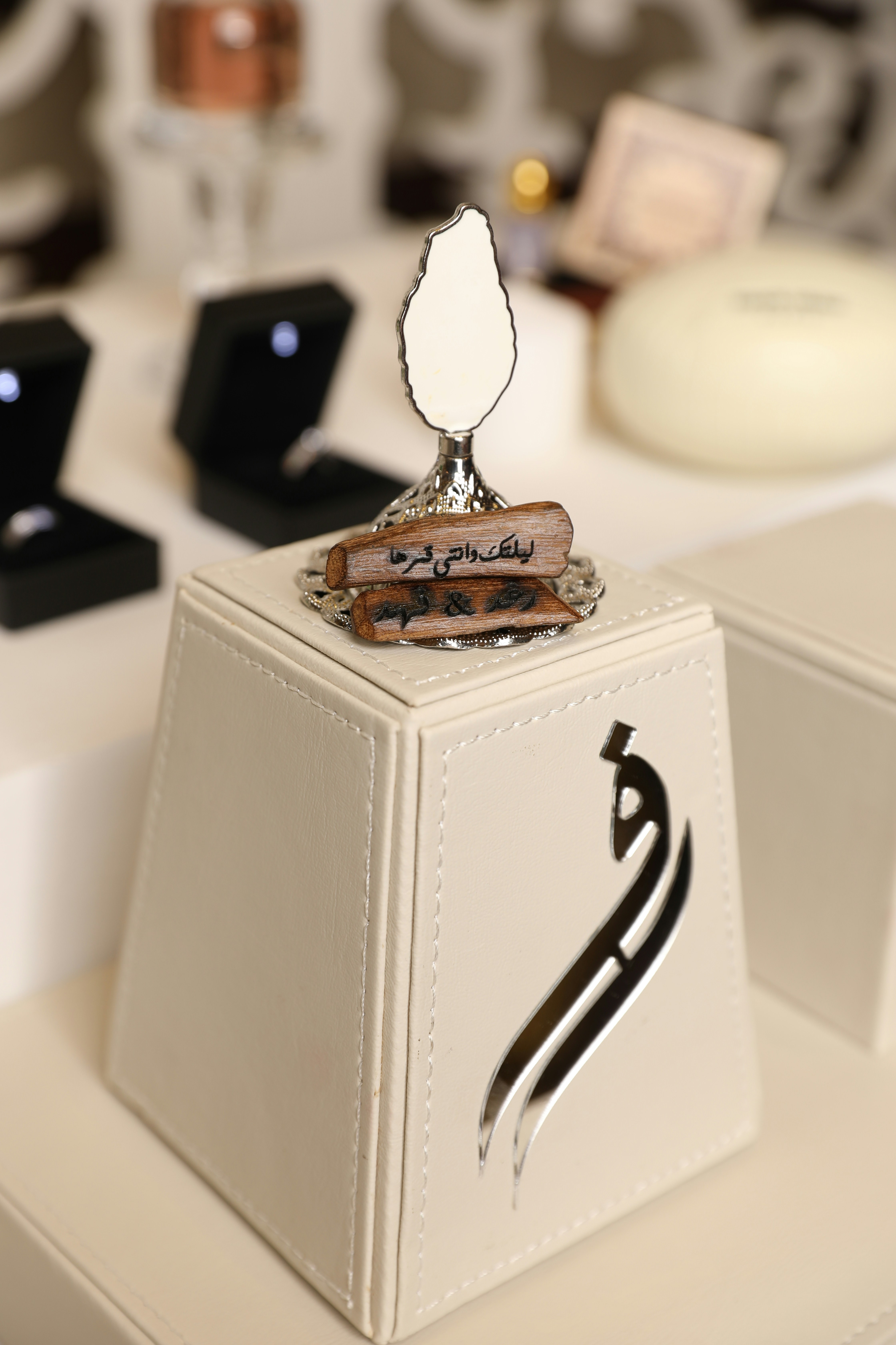 A decorative stand with arabic calligraphy and other objects. photo ...