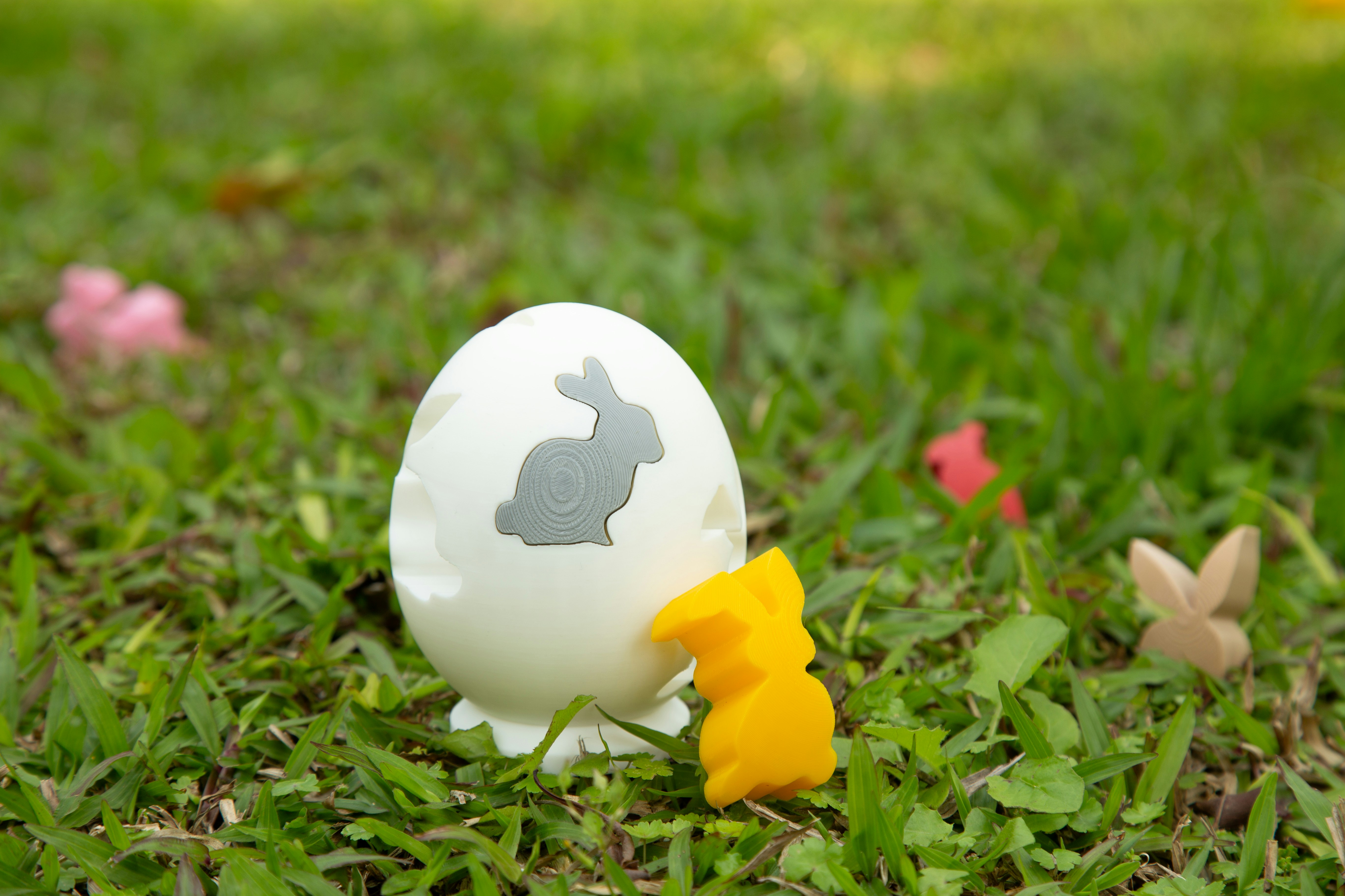 Easter egg with rabbit details sits on grass. photo – Free Easter Image ...