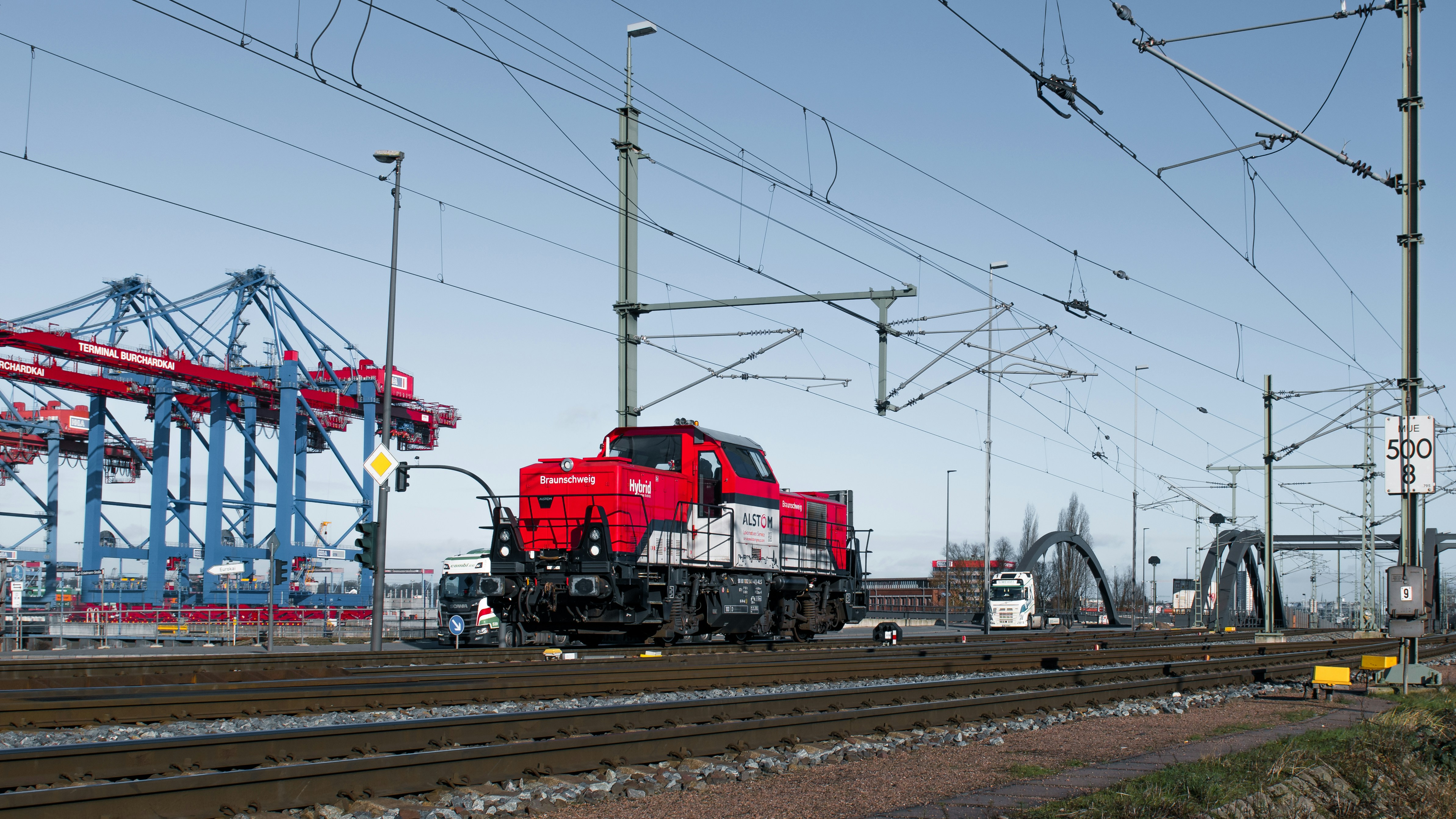 A red train moves near a harbor. photo – Free Train Image on Unsplash