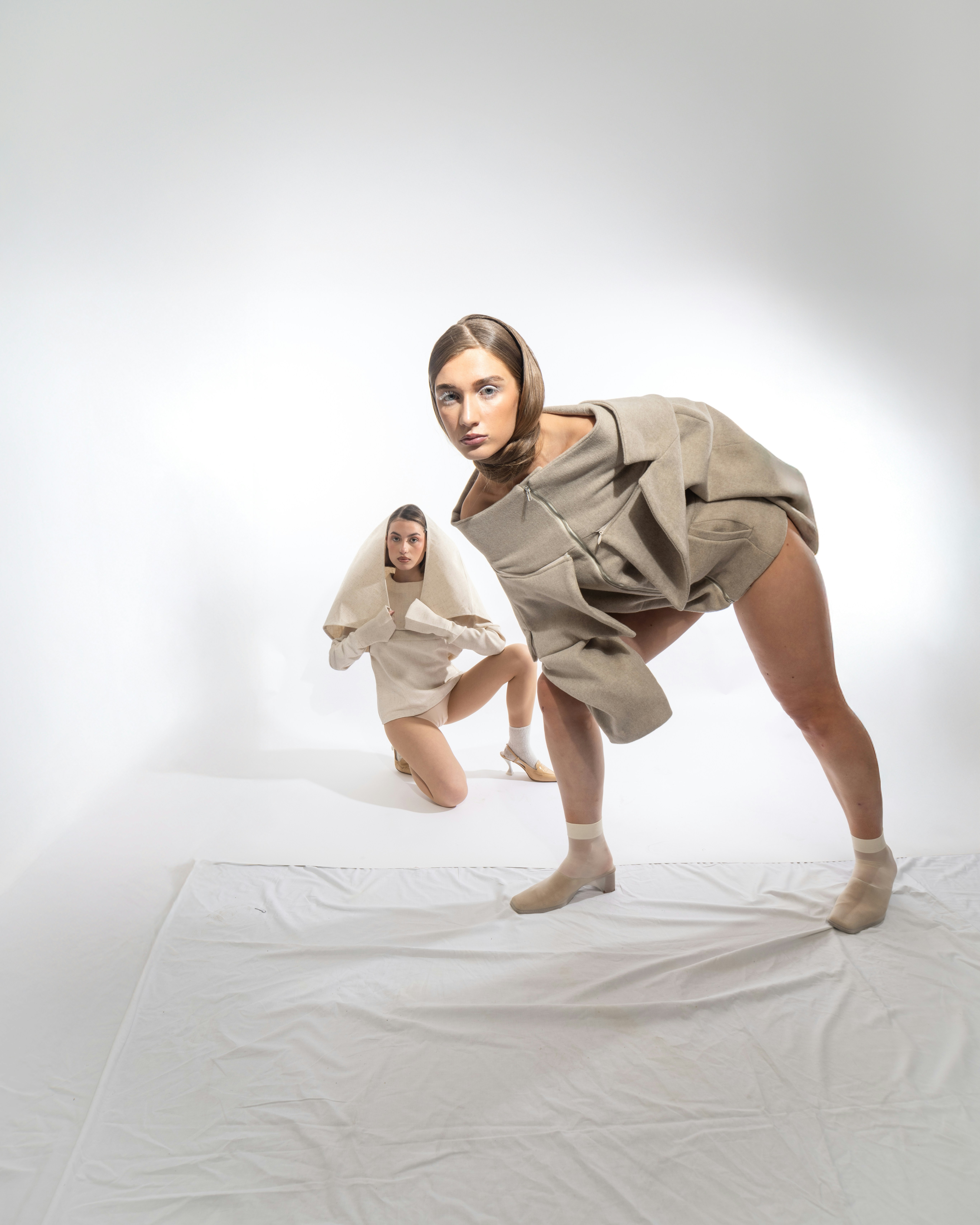 Two people pose creatively in unique outfits. photo – Free Fashion ...