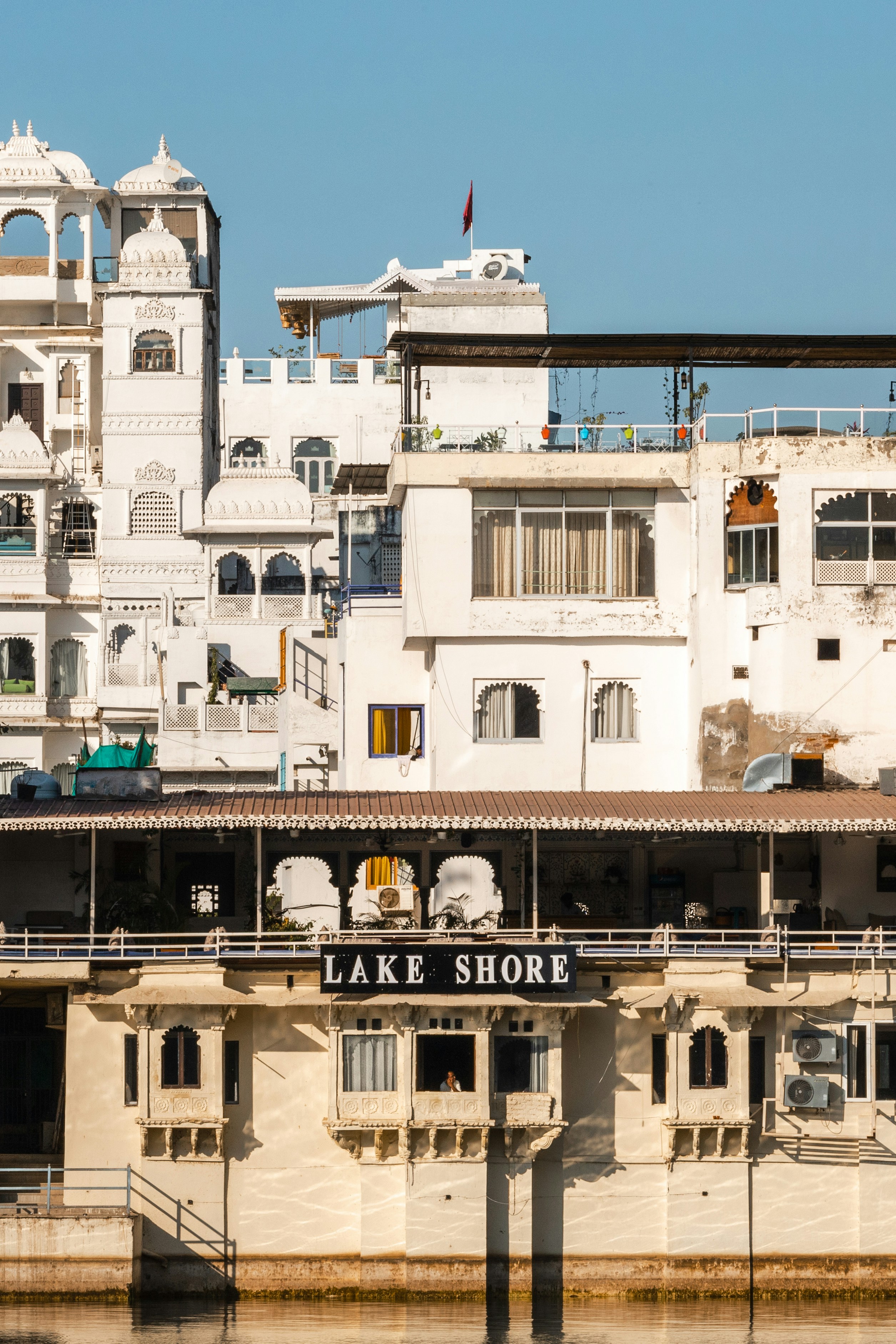 White buildings line the lake's shore. photo – Free Architecture Image ...