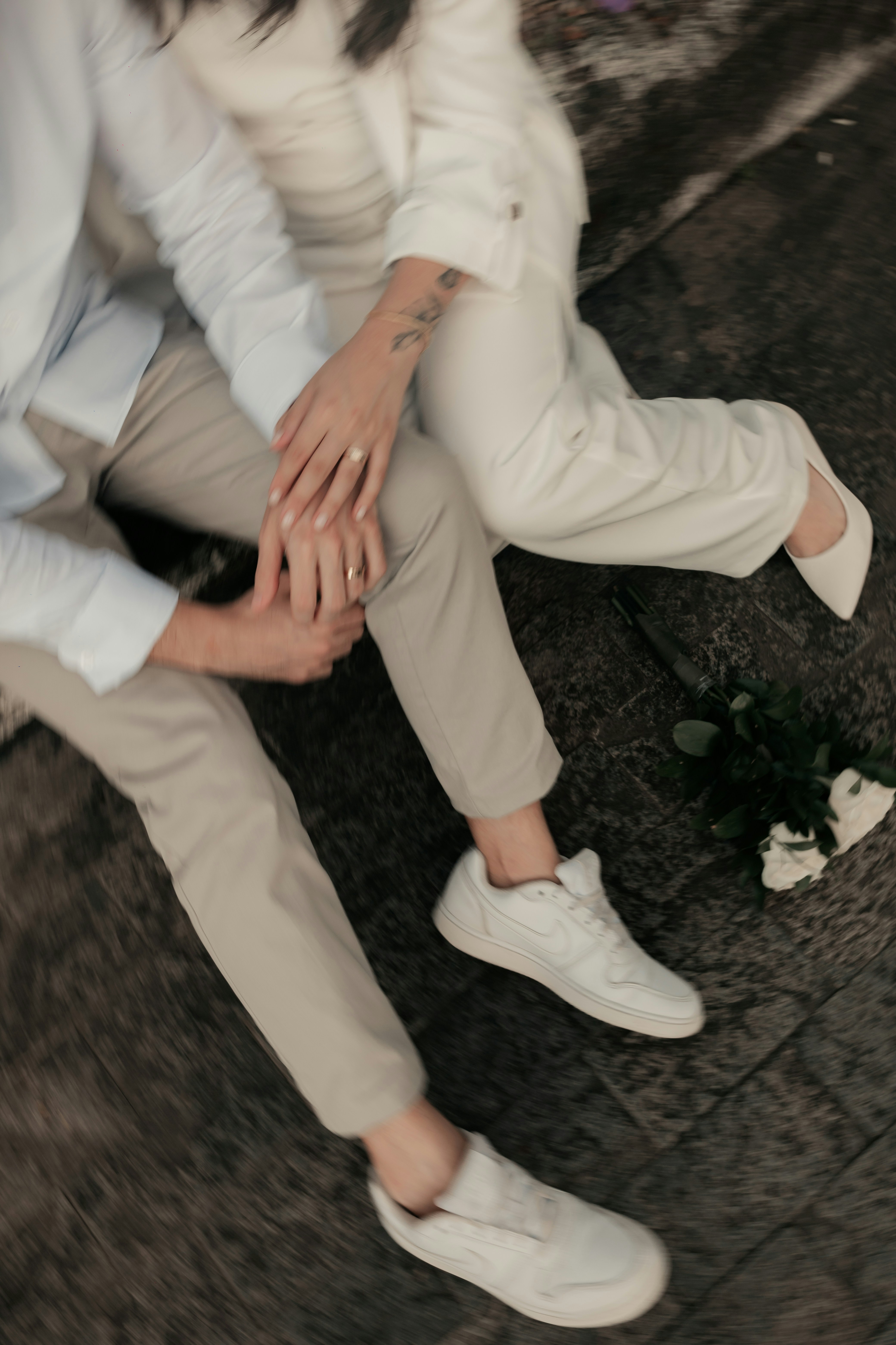Intertwined Hands on a Stone Terrace