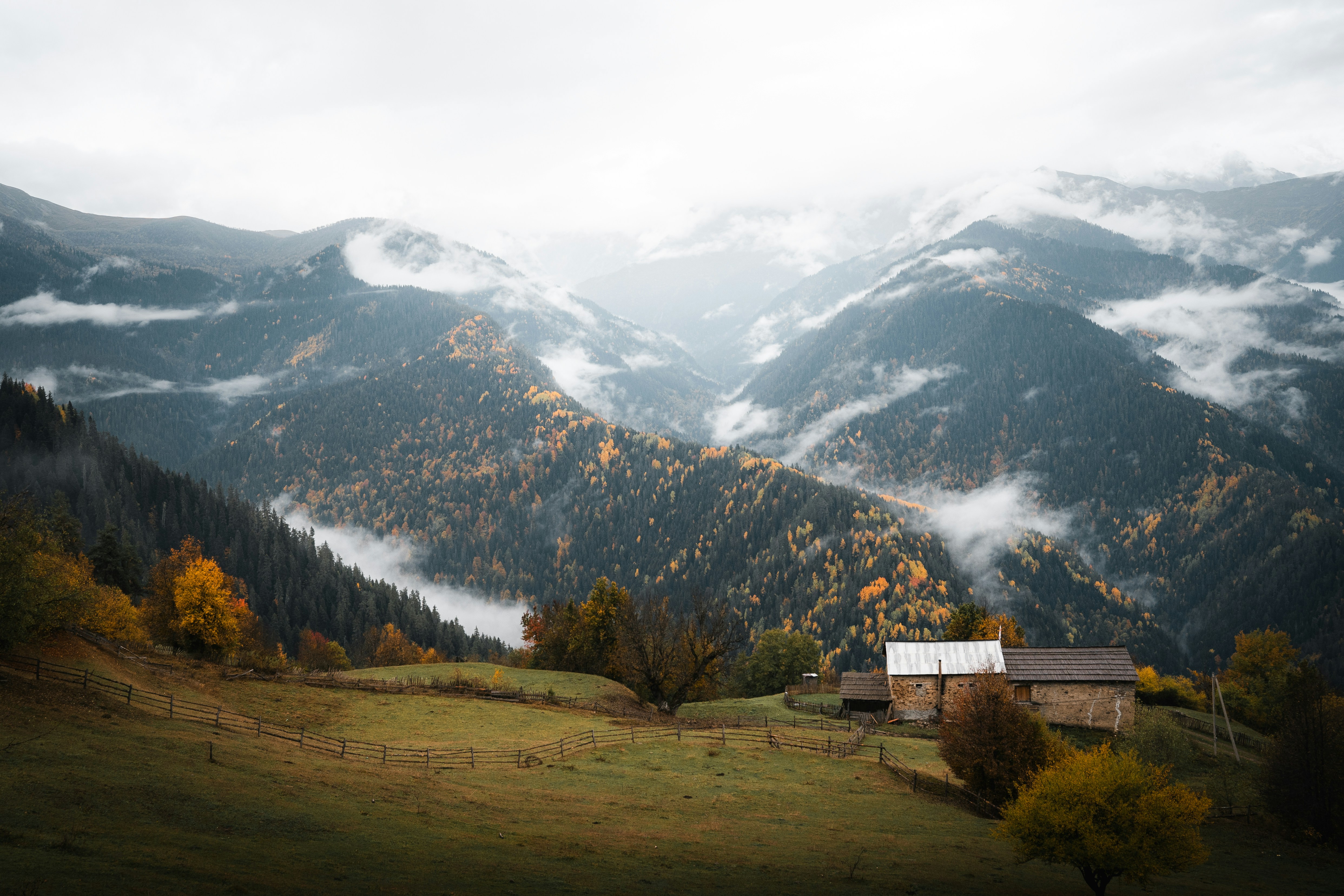 Mountains and a small cabin bathed in mist. photo – Free Wallpaper ...