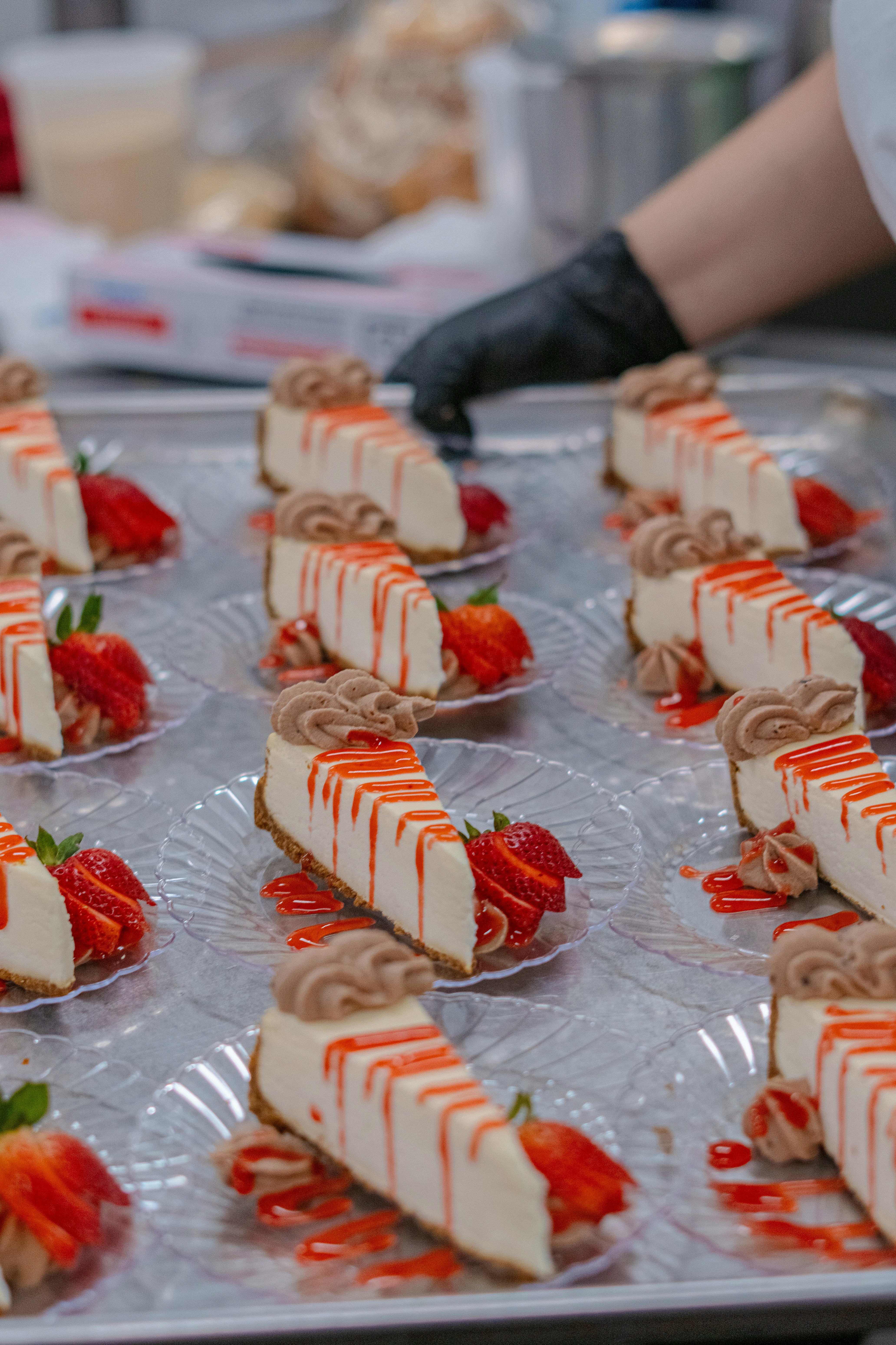 Strawberry-topped Cheesecake Squares Aligned for the Plate